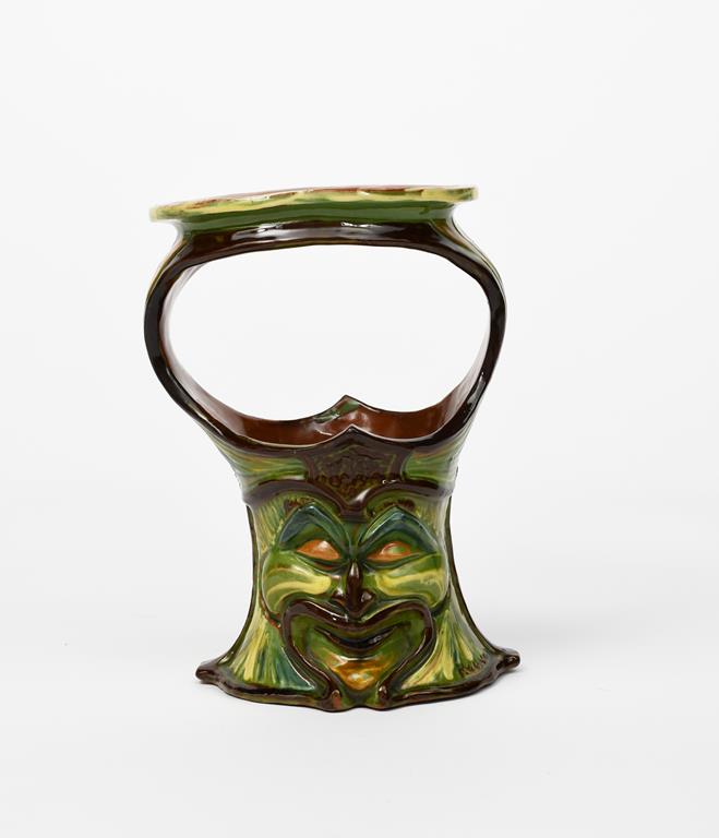 An unusual C H Brannam Barum Ware vase, dated 1900, modelled in relief ...