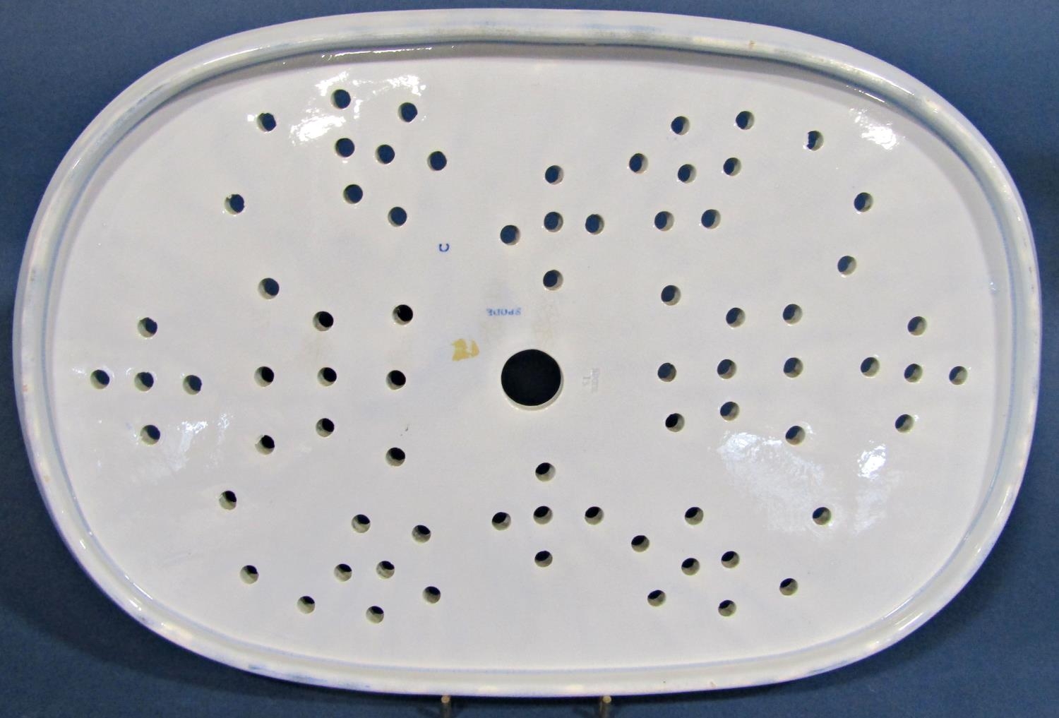 A 19th century Spode gravy drainer with printed detail showing the ...