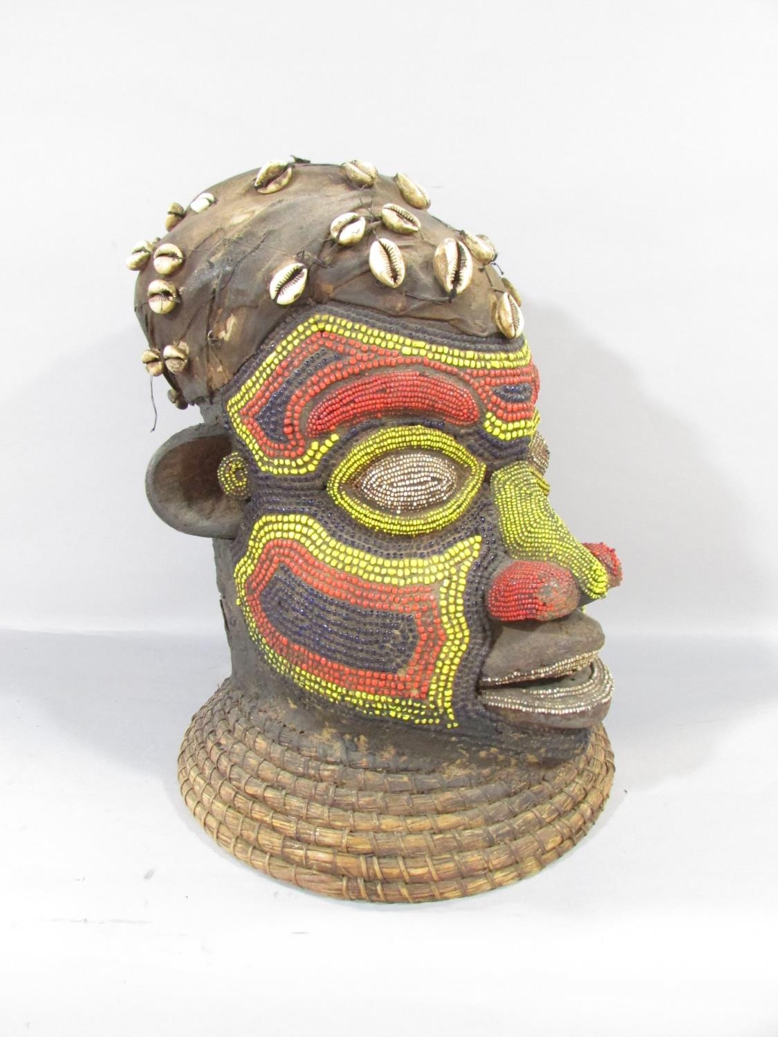 A large African Bamileke or Bamum beaded head, leather capped, and ...
