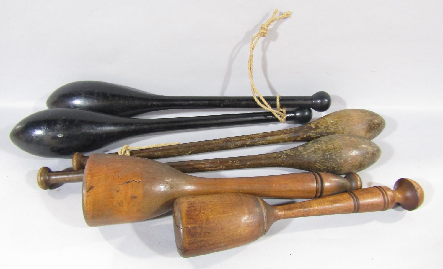 Two pairs of vintage Indian exercise batons “Meels”, together with two ...