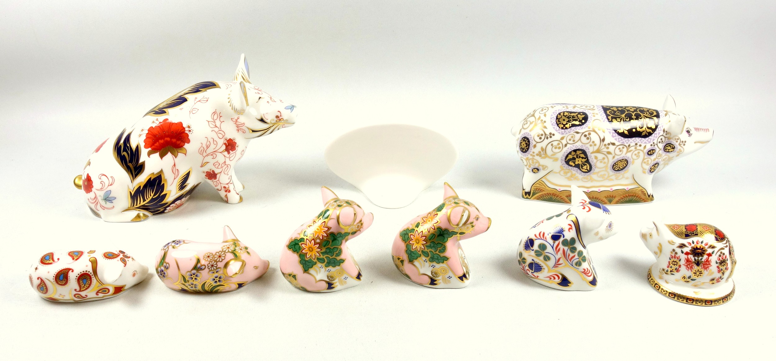 Royal Crown Derby "Prudence" piggy bank, W.18cm; 7 other pigs, and a ...