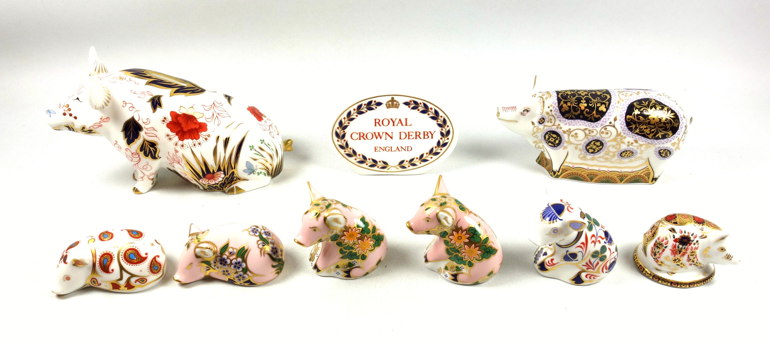 Royal Crown Derby "Prudence" piggy bank, W.18cm; 7 other pigs, and a ...