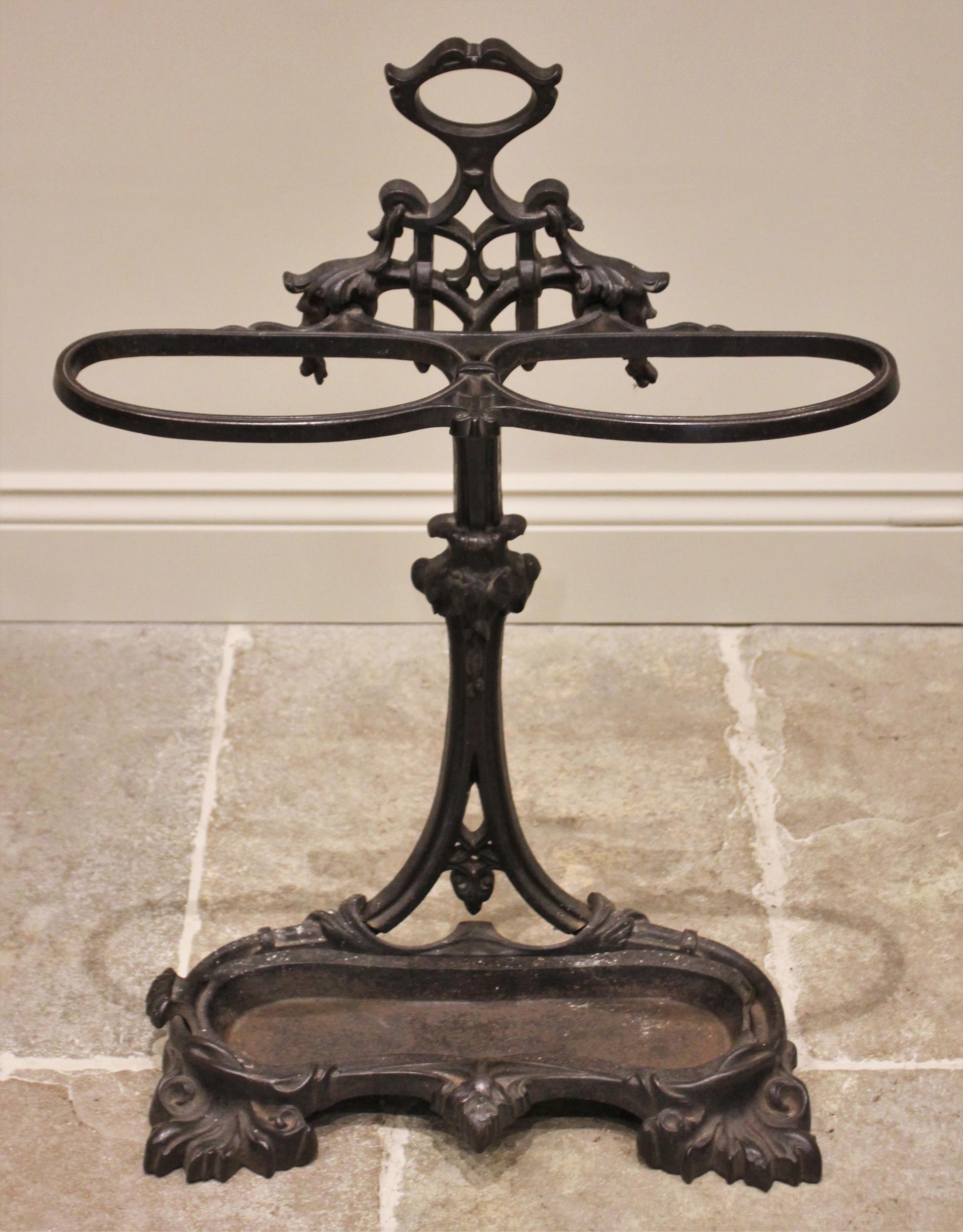 A Coalbrookdale style cast iron stick stand, the pierced and ...