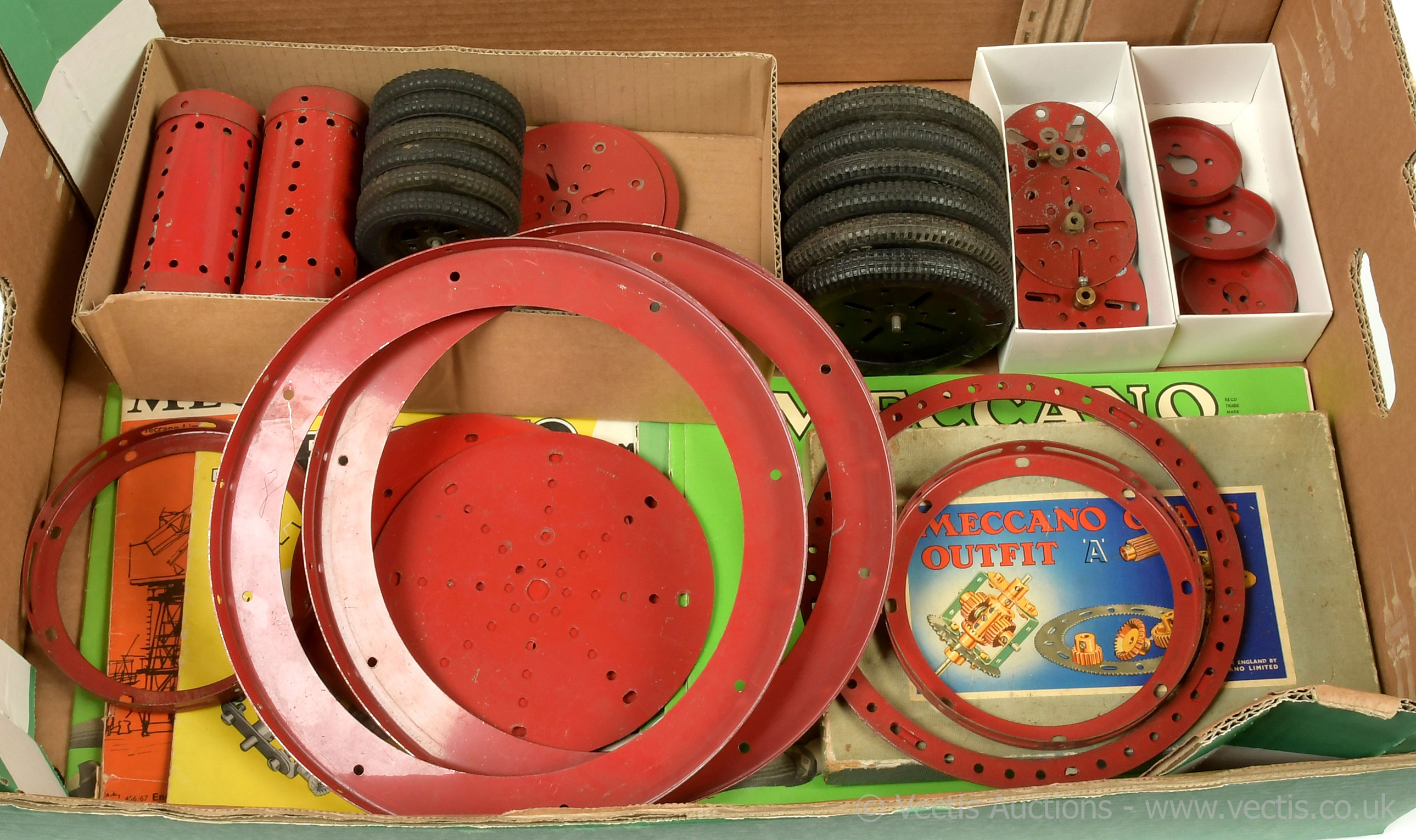 A collection of 1950's red/green Meccano circular parts including large ...