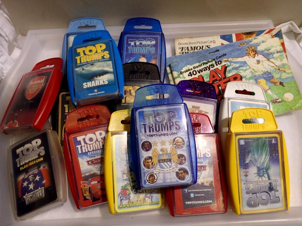 Fourteen packs of Top Trump cards and three incomplete tea card books ...