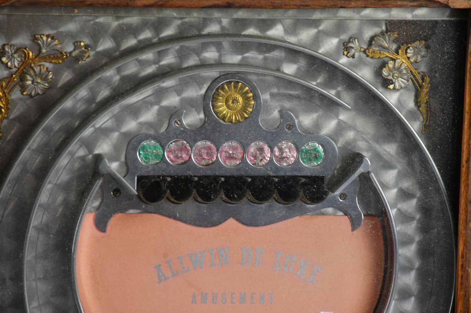 ALLWIN DE LUXE AMUSEMENT; an oak cased penny slot machine, height 65cm ...