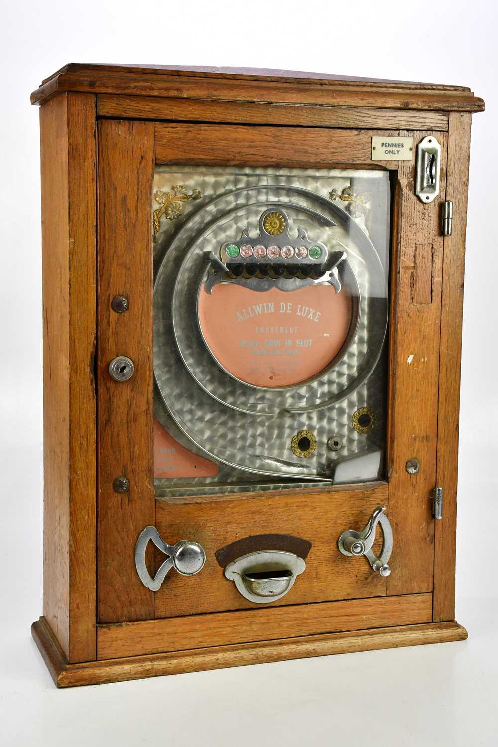 ALLWIN DE LUXE AMUSEMENT; an oak cased penny slot machine, height 65cm ...