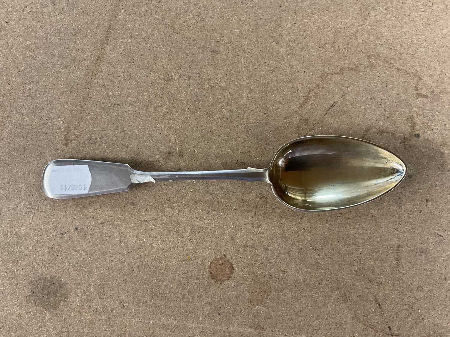 A Russian 84 grade silver tablespoon, with gilt wash bowl and elaborate ...