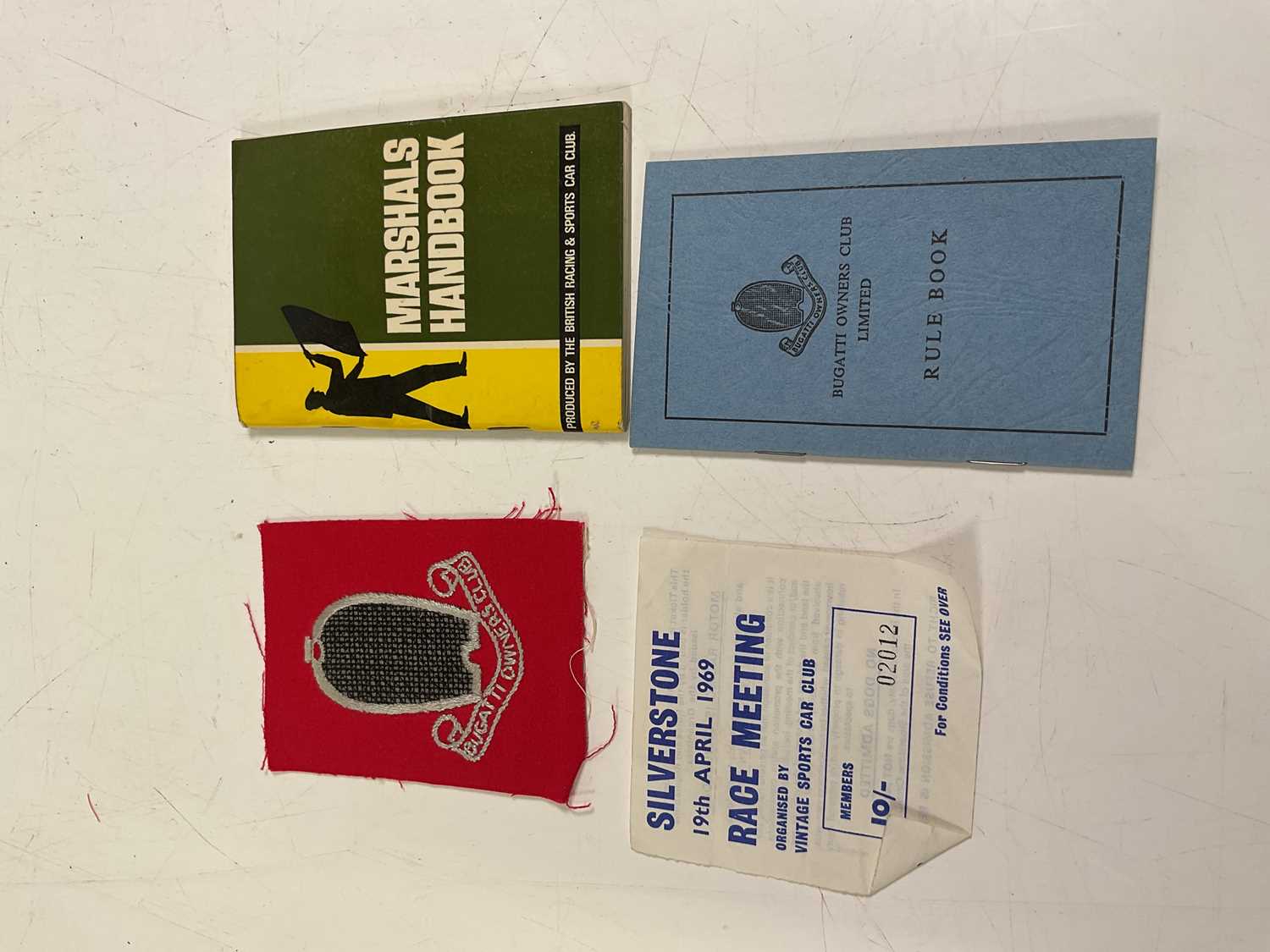 A collection of Bugatti Owners Club badges and ephemera including ...