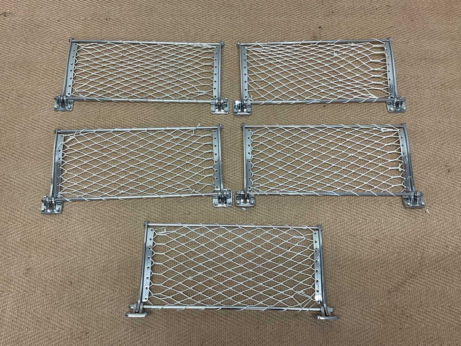 Five post war era railway carriage chrome and netting luggage racks ...
