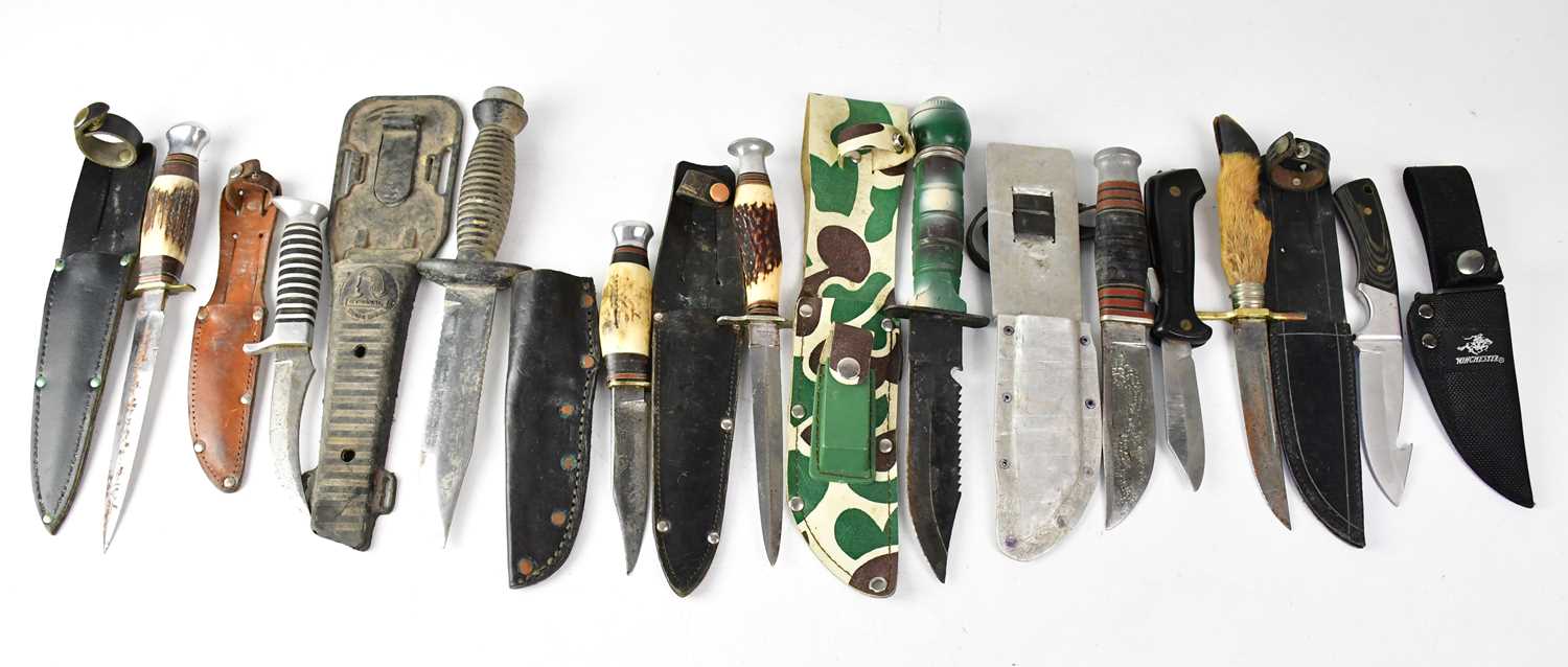 A group of ten various hunting, game, fishing and scout knives ...