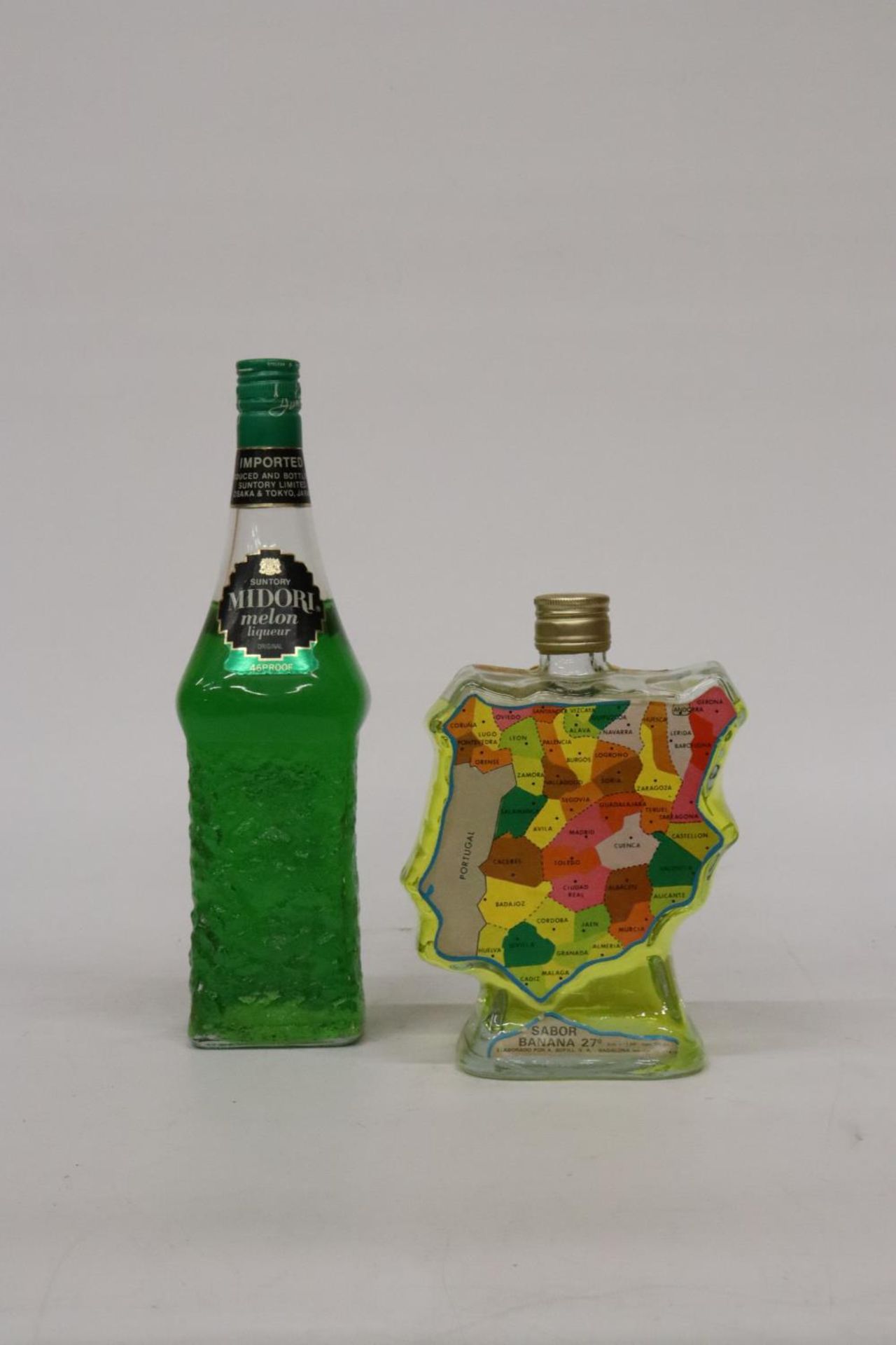 TWO BOTTLES OF LIQUOR TO INCLUDE A MAP OF SPAIN BANANA LIQUEUR AND ...
