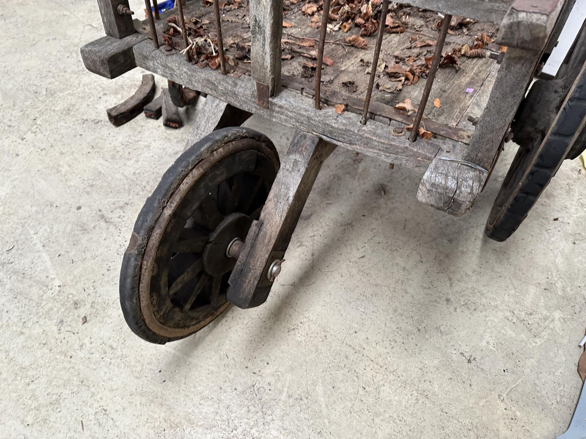 A VINTAGE INDIAN THREE WHEELED HAND CART (ONE WHEEL REQUIRES REPAIR)