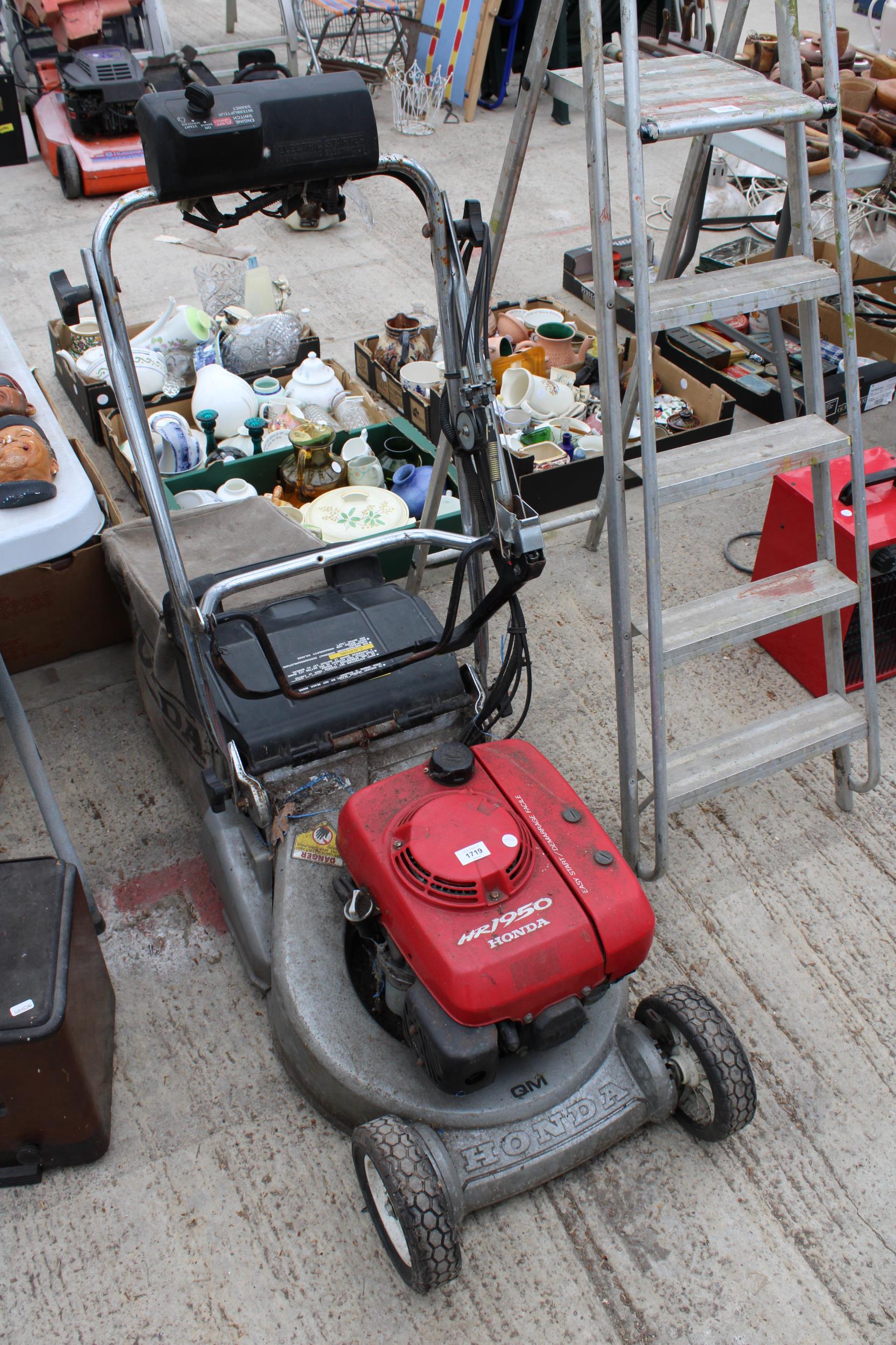 A HONDA HR1950 PETROL LAWN MOWER WITH GRASS BOX