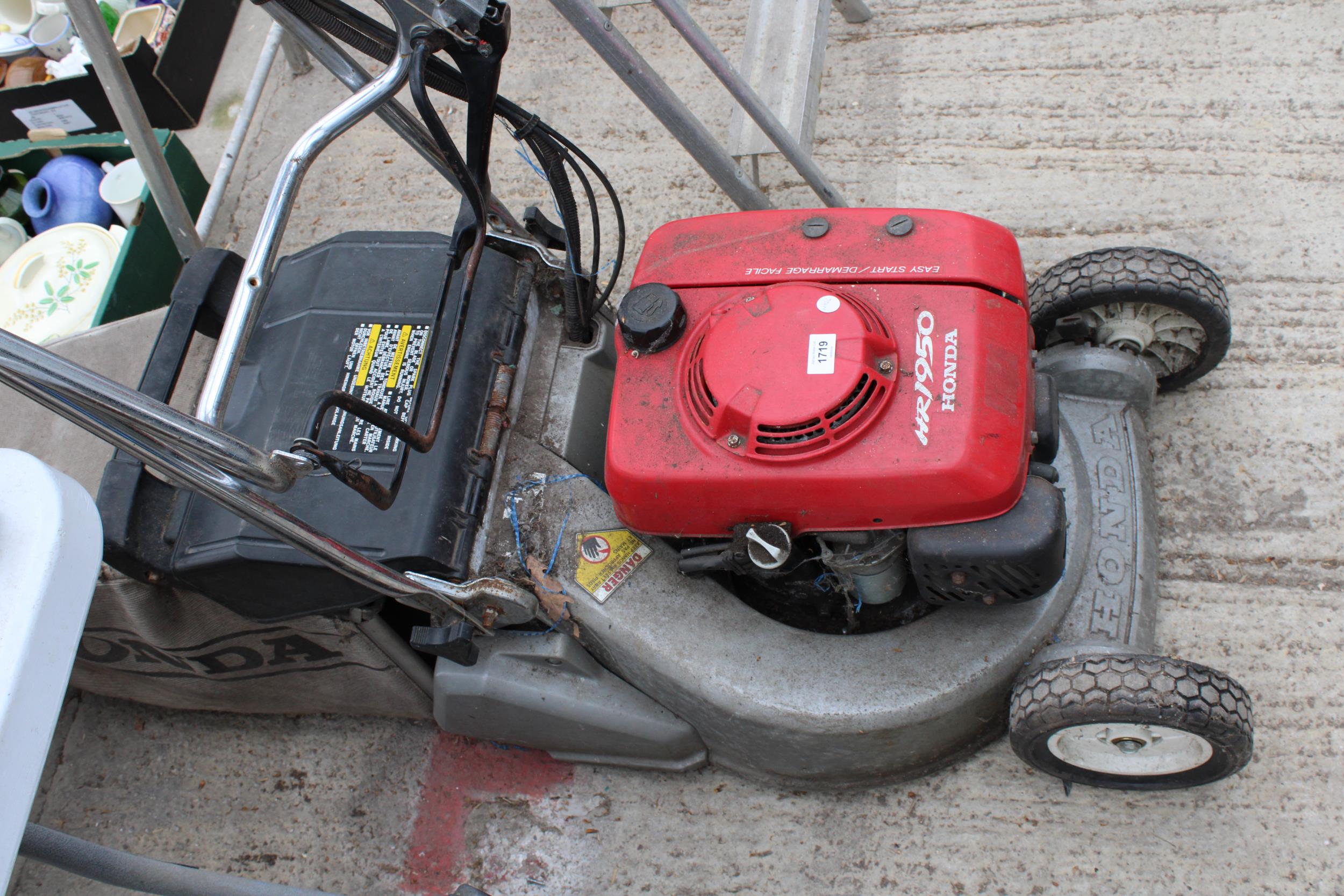 A HONDA HR1950 PETROL LAWN MOWER WITH GRASS BOX