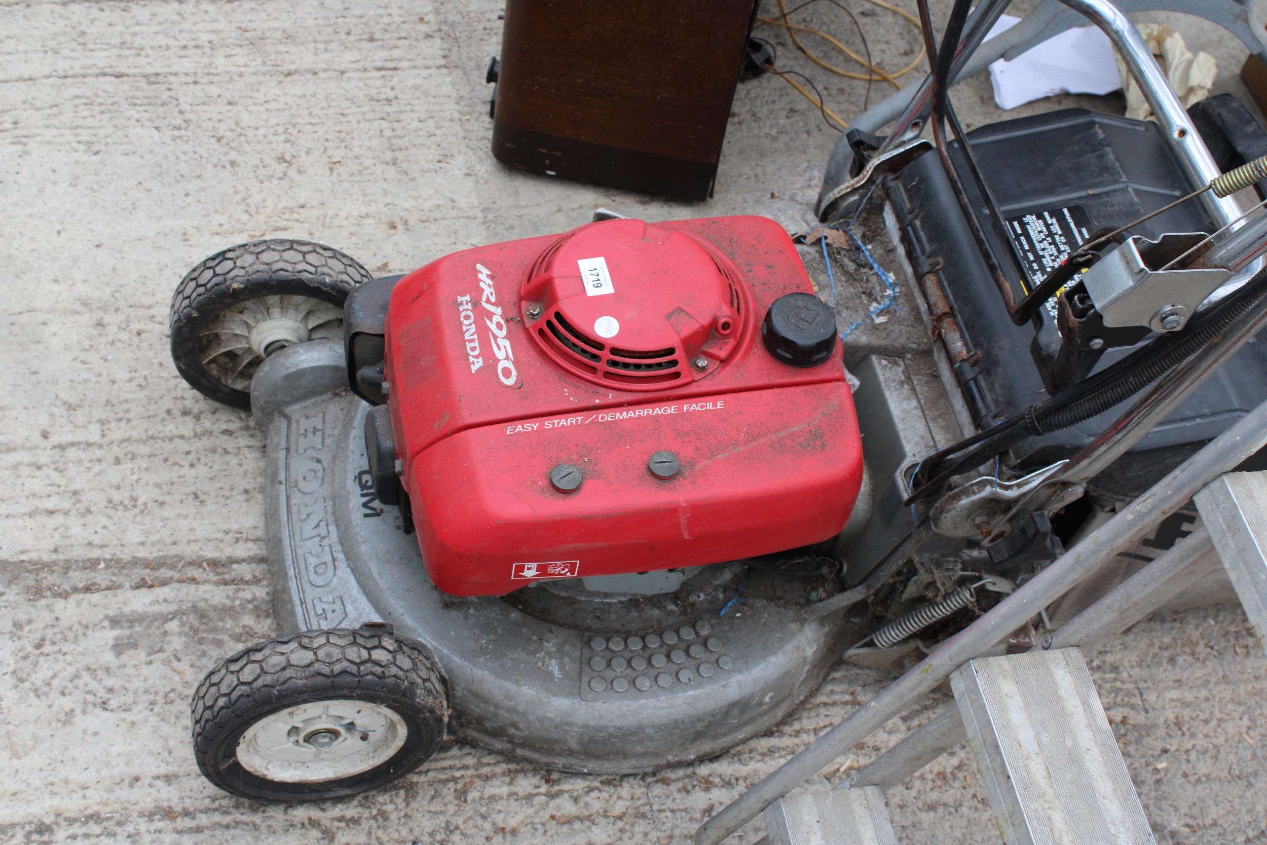 A HONDA HR1950 PETROL LAWN MOWER WITH GRASS BOX