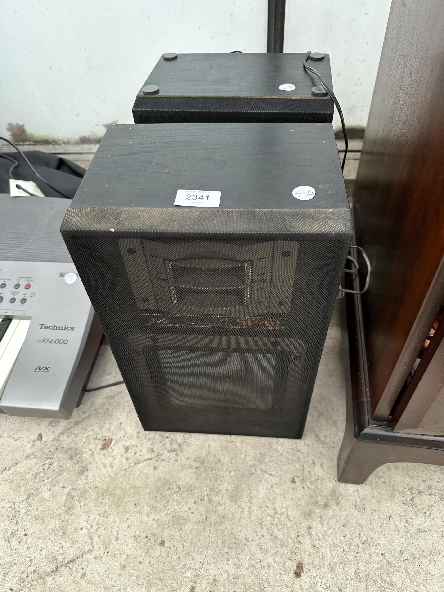 A JVC STEREO SYSTEM WITH CABINET AND A PAIR OF SPEAKERS