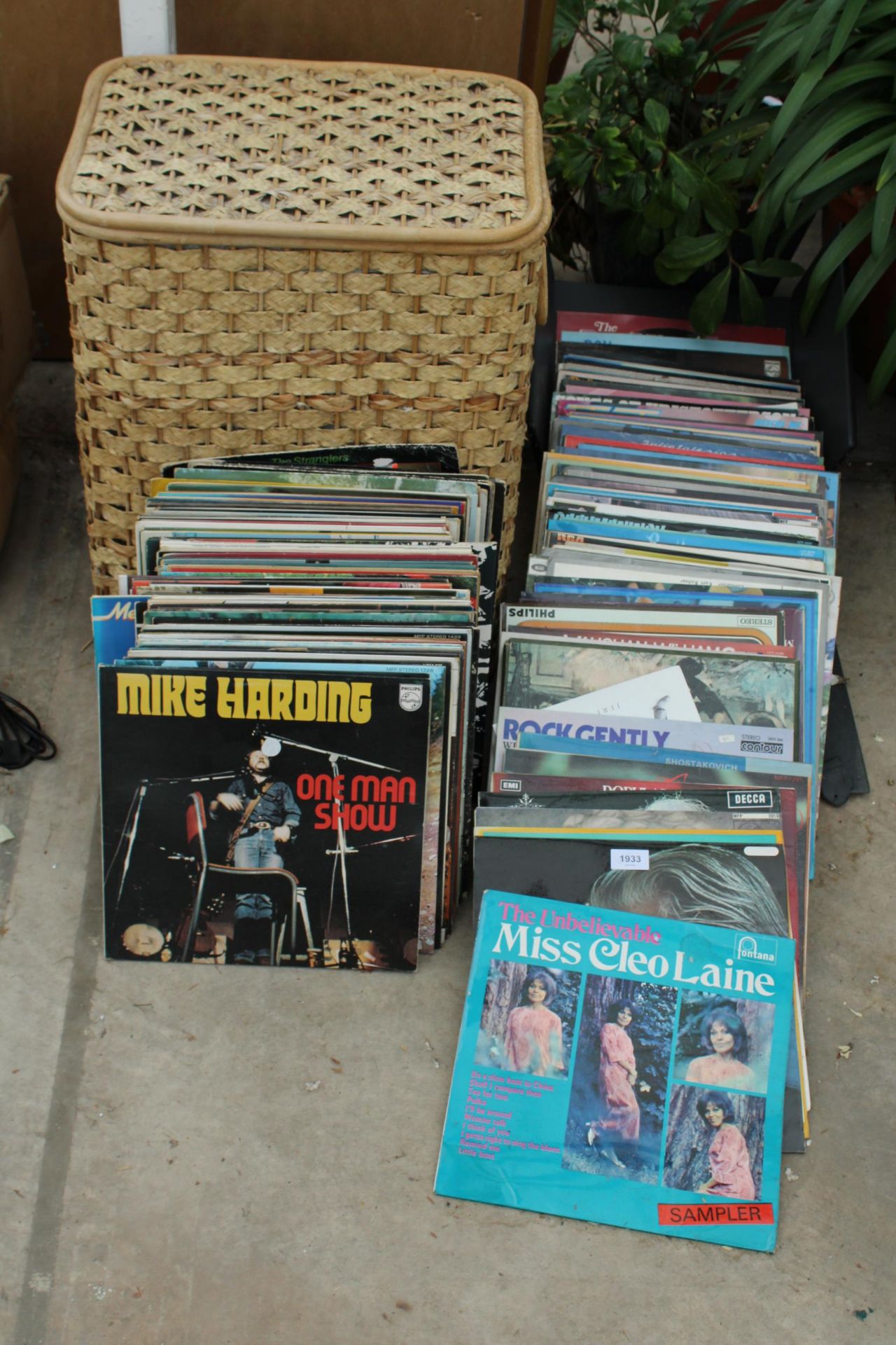 A WICKER BASKET AND A LARGE ASSORTMENT OF LP RECORDS