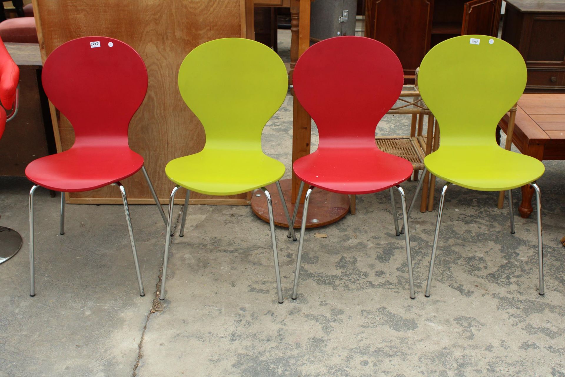 FOUR COLOURED PLYWOOD KEELER STYLE STACKING CHAIRS, TWO RED AND TWO ...
