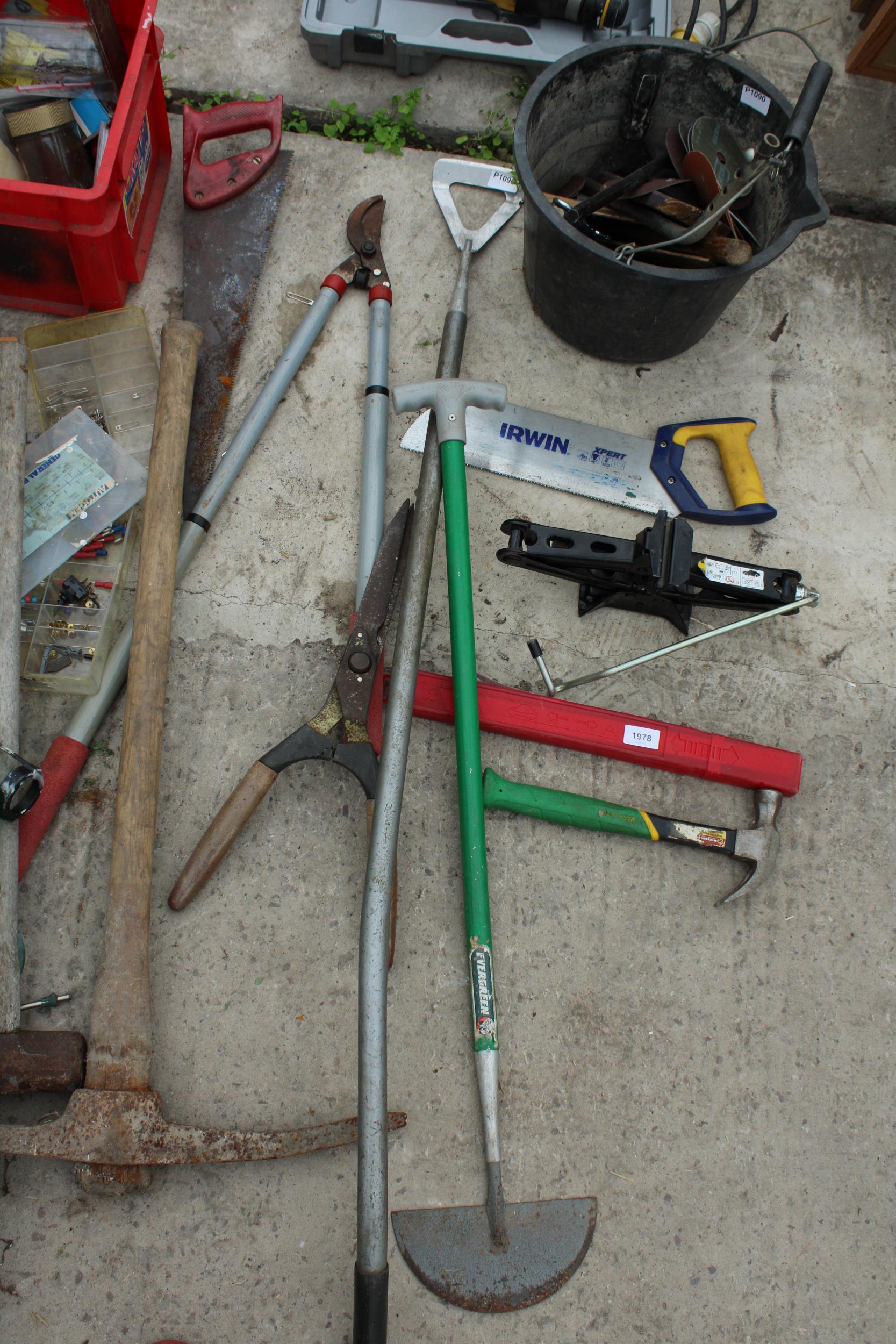 AN ASSORTMENT OF TOOLS TO INCLUDE A PICK AXE, A BOSCH ELECTRIC DRILL ...