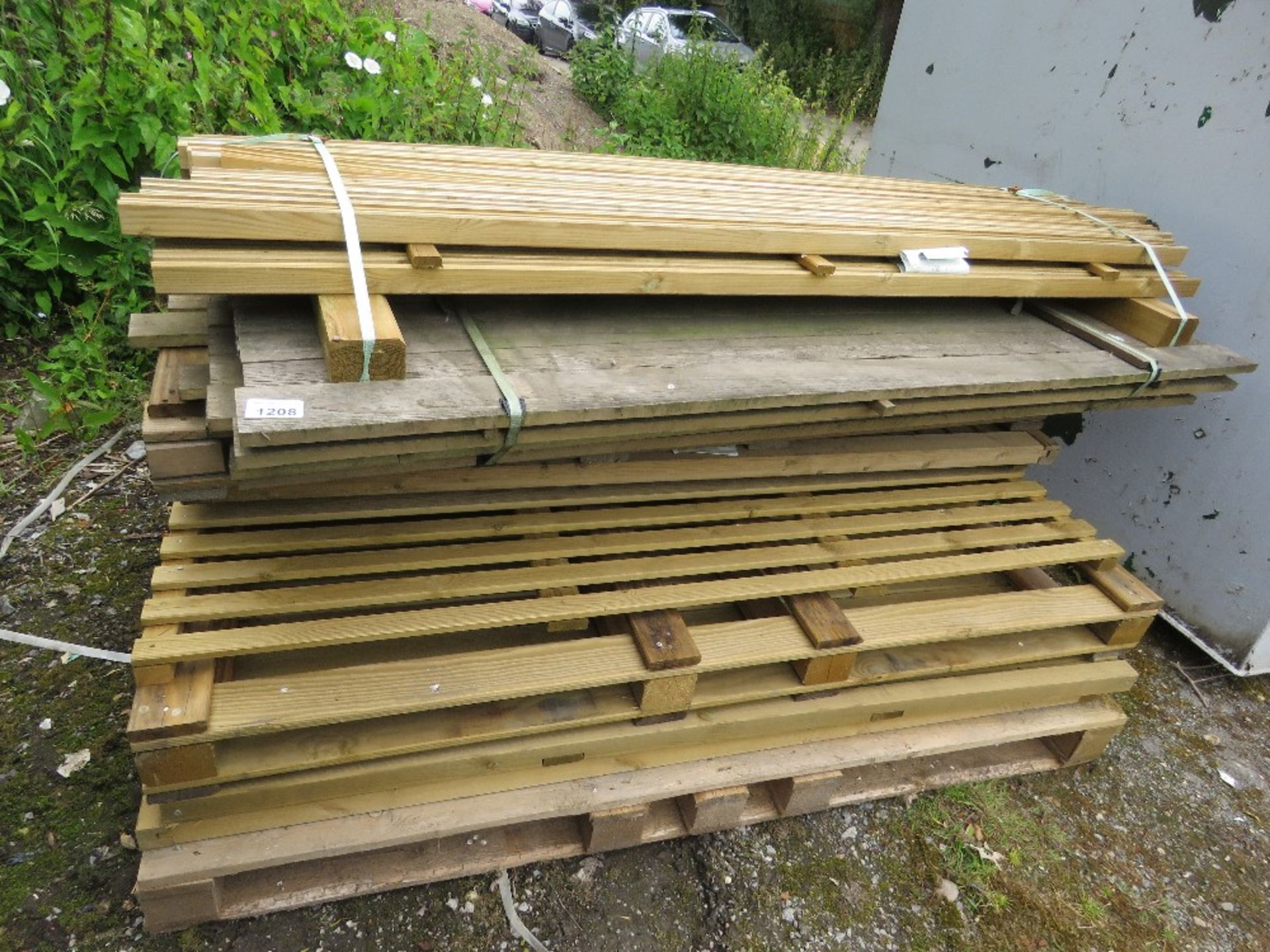 STACK OF ASSORTED FENCE PANELS AND TIMBERS AS SHOWN