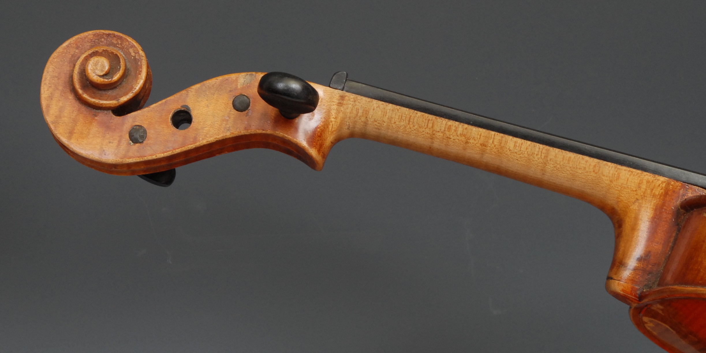 A violin, the two-piece back 36cm long excluding button, ebony tuning ...