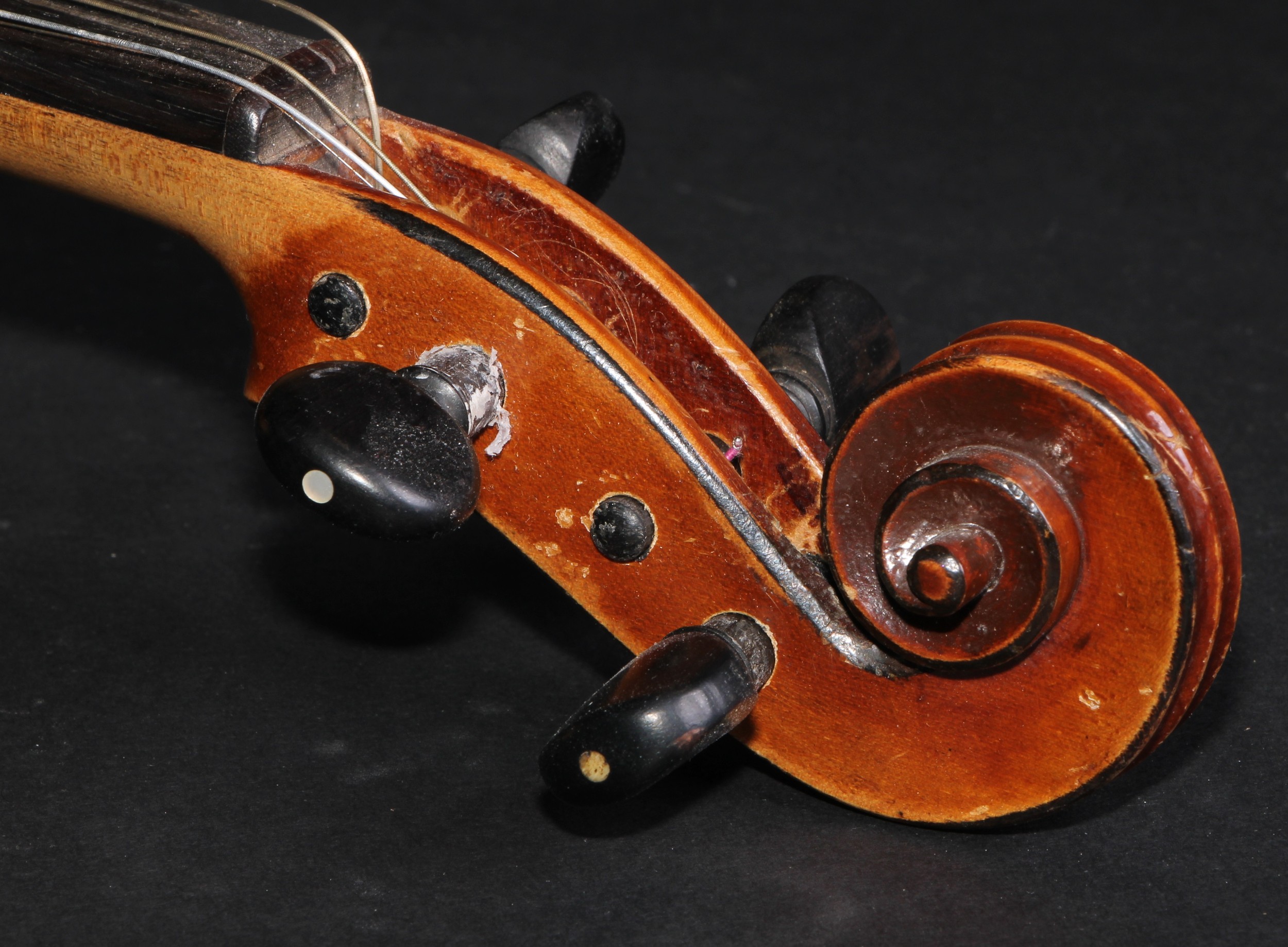 A violin, the two-piece back 36cm long excluding button, paper ...