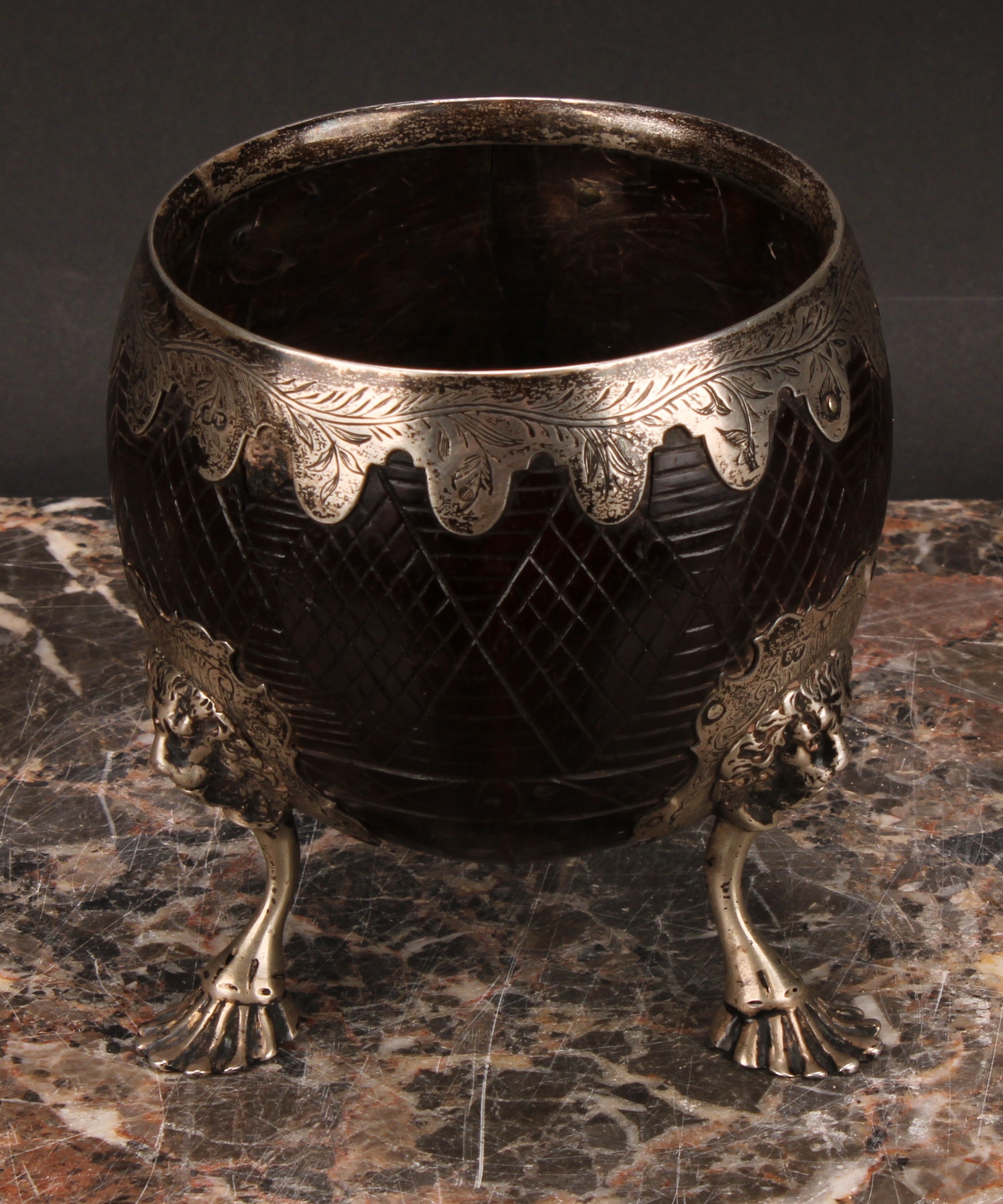 A George III silver mounted coconut cup, the fittings engraved with ...