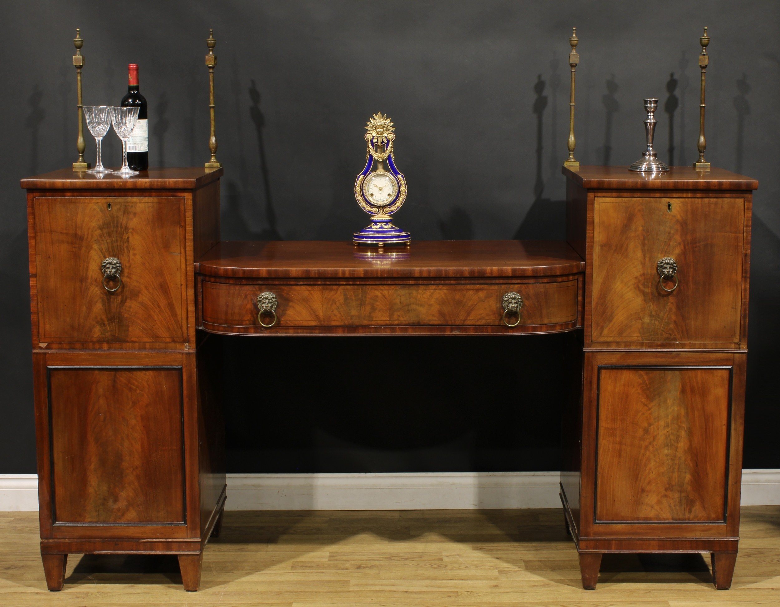 A Regency mahogany twin pedestal sideboard, sunken-centre with a long ...