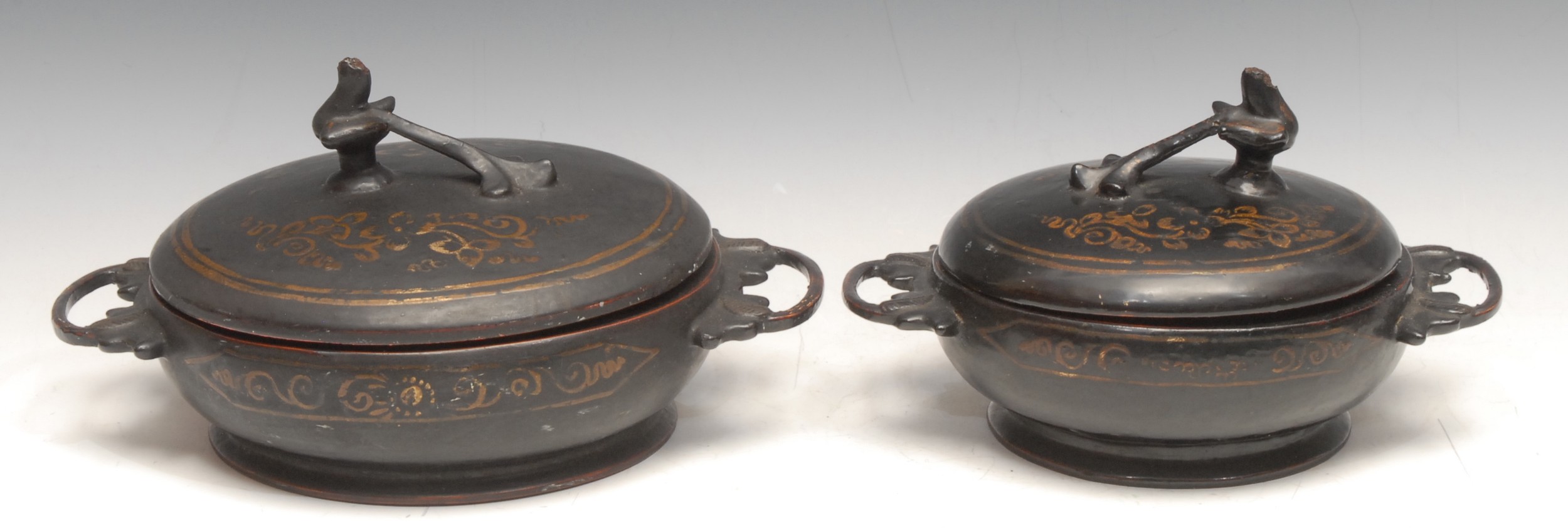 A graduated pair of Chinese lacquer tureens and covers, the largest ...