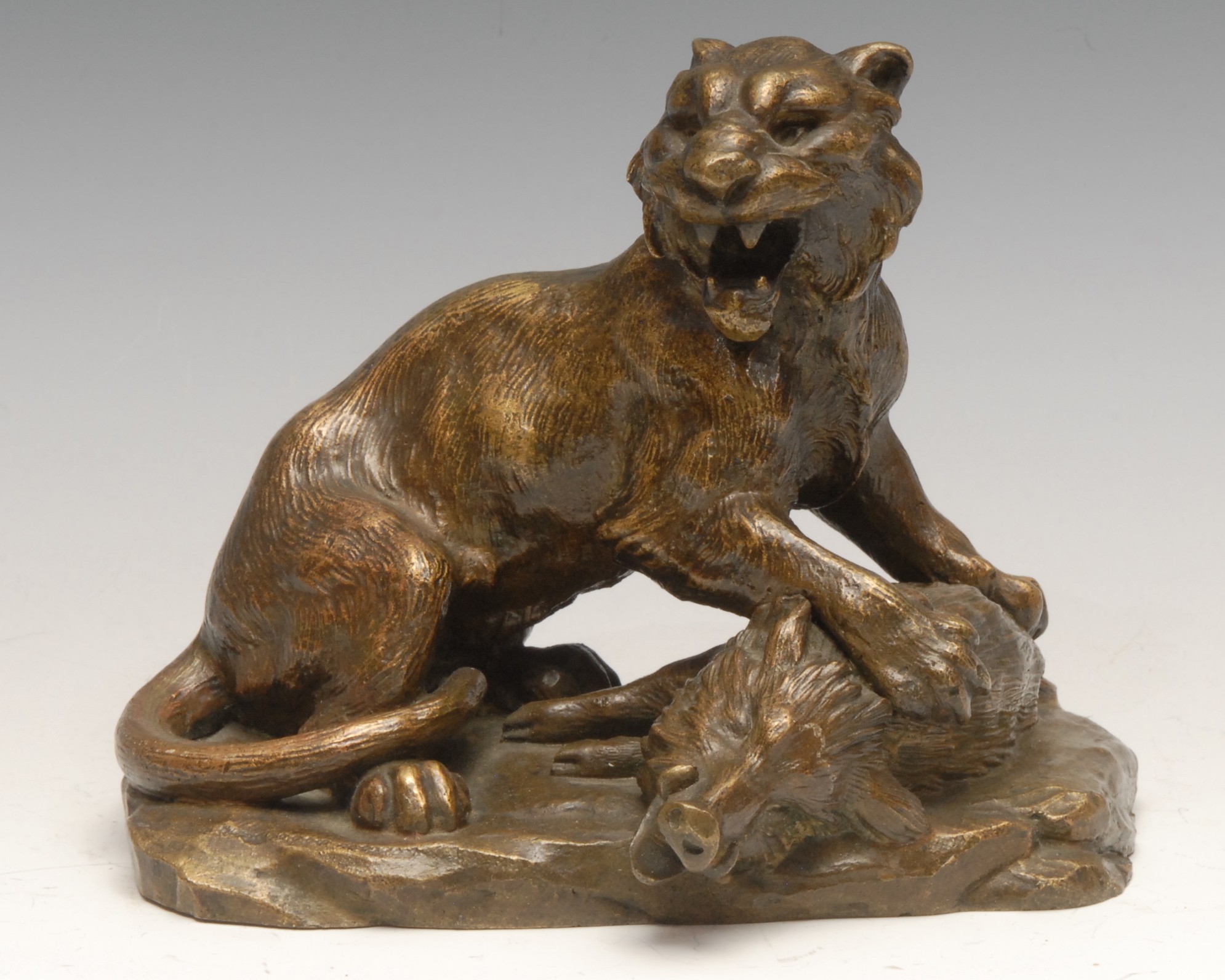 A 19th century French bronze, of a ferocious lion attacking a boar ...