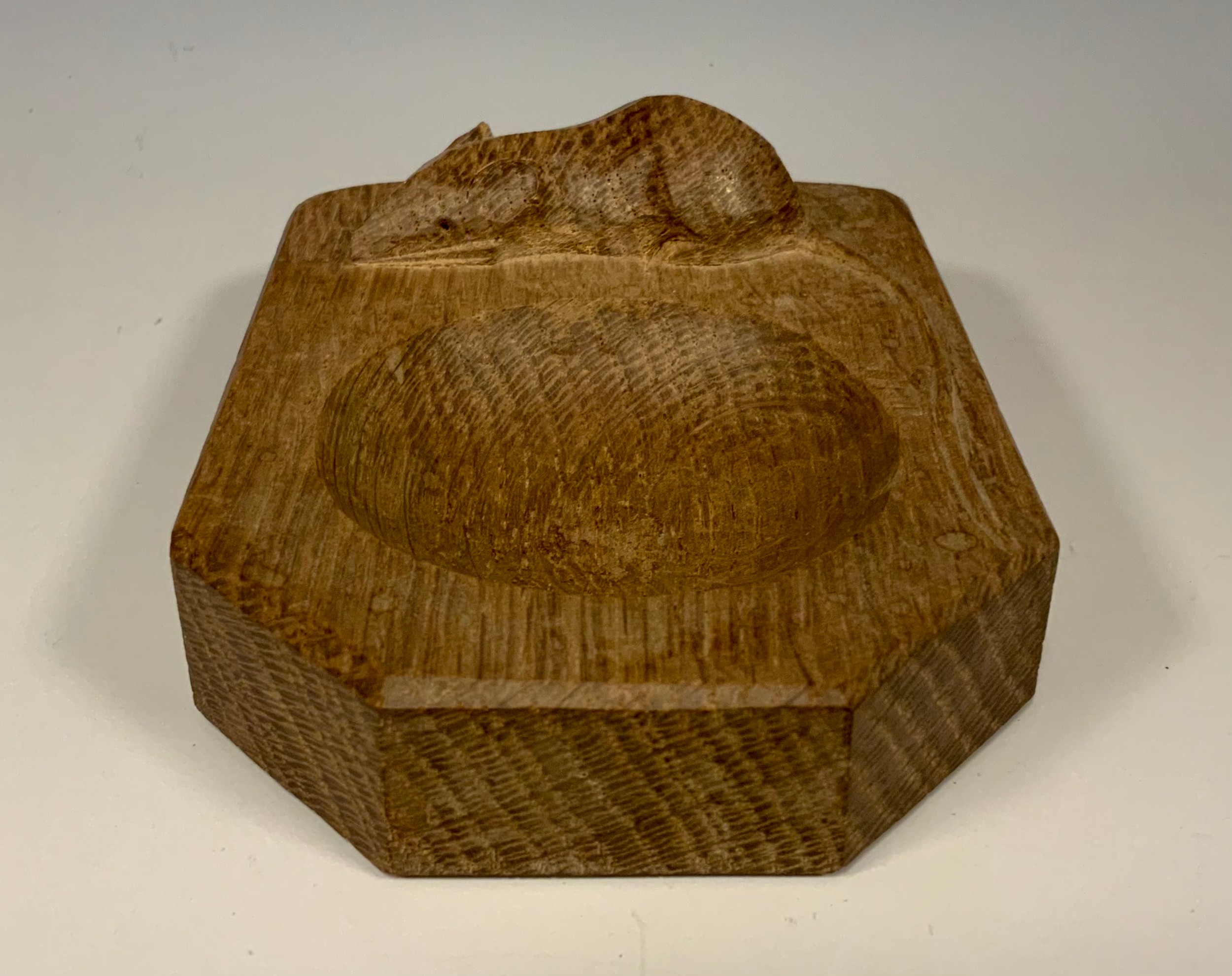 A Robert Mouseman Thompson carved oak ashtray, 10.3cm long.