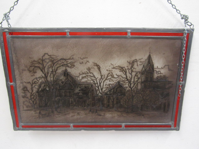 A stained glass picture of a churchyard 44x26cm