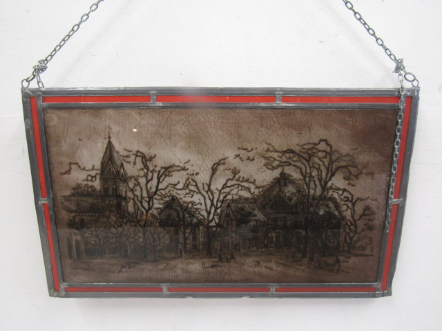 A stained glass picture of a churchyard 44x26cm