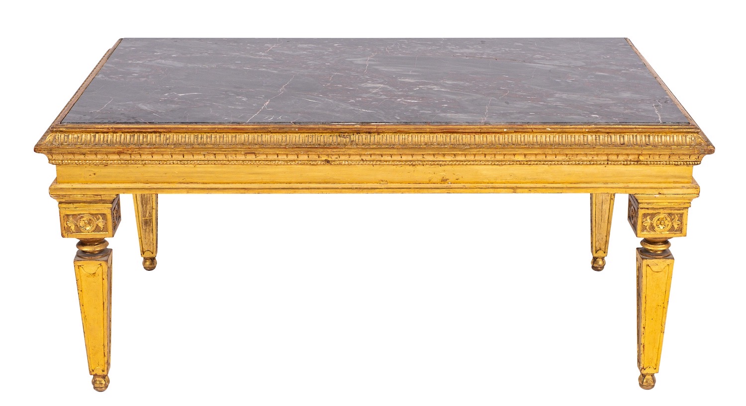 A carved giltwood and marble topped rectangular low table in Louis XVI style, early 20th century;
