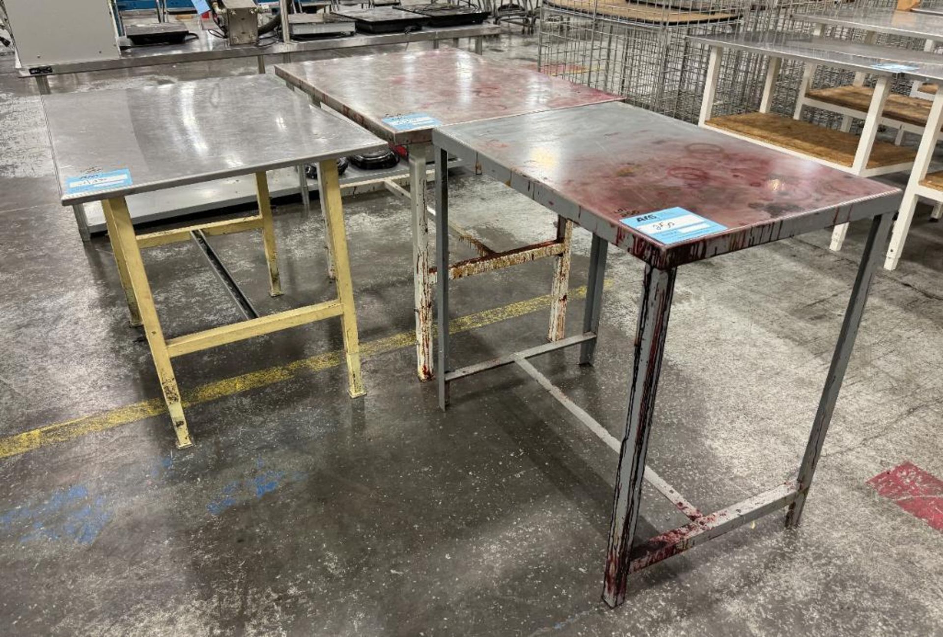 Lot Of (3) Tables. (2) With stainless steel tops, (1) steel.