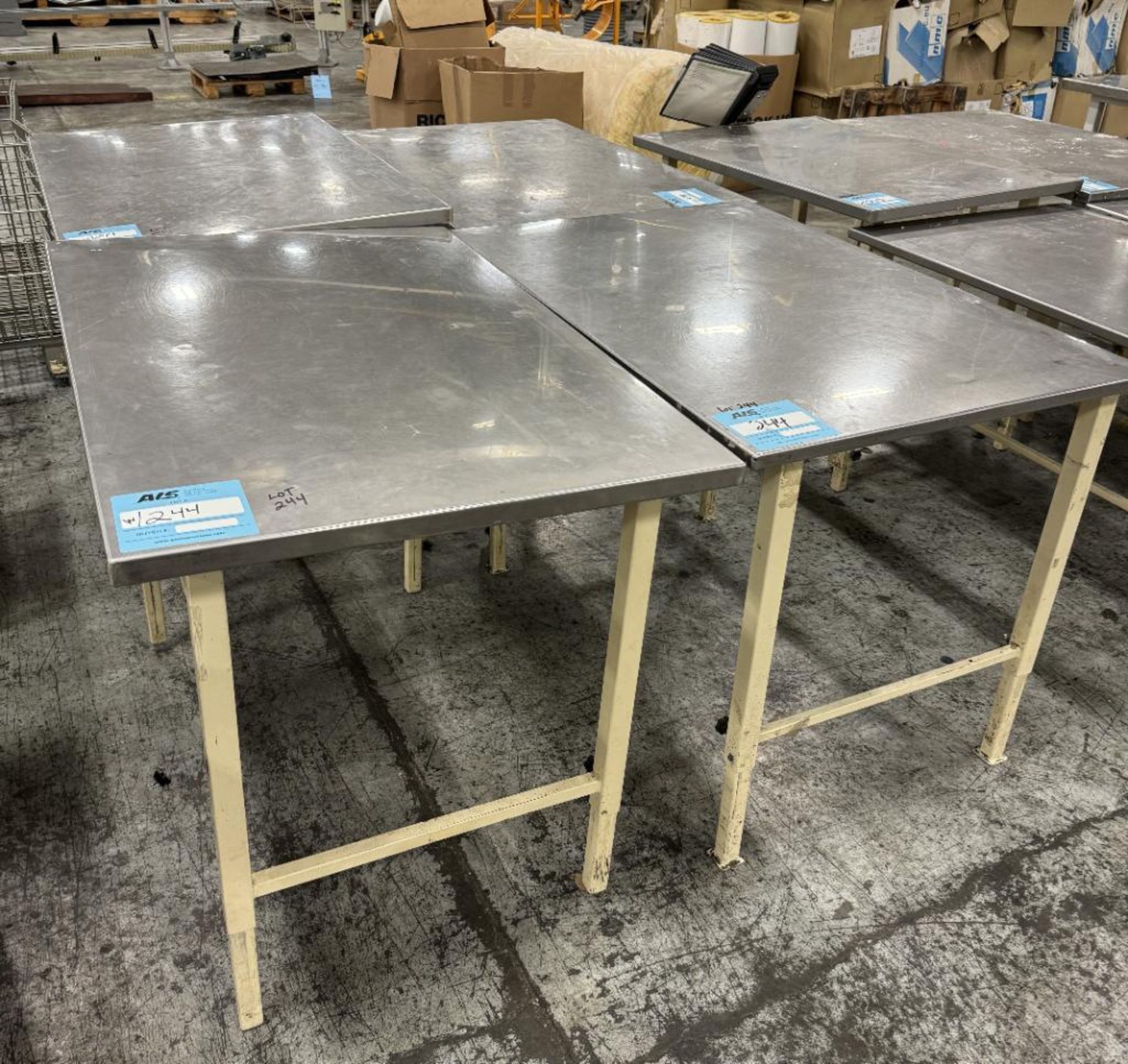 Lot Of (4) Stainless Steel Top Tables. With steel frame.