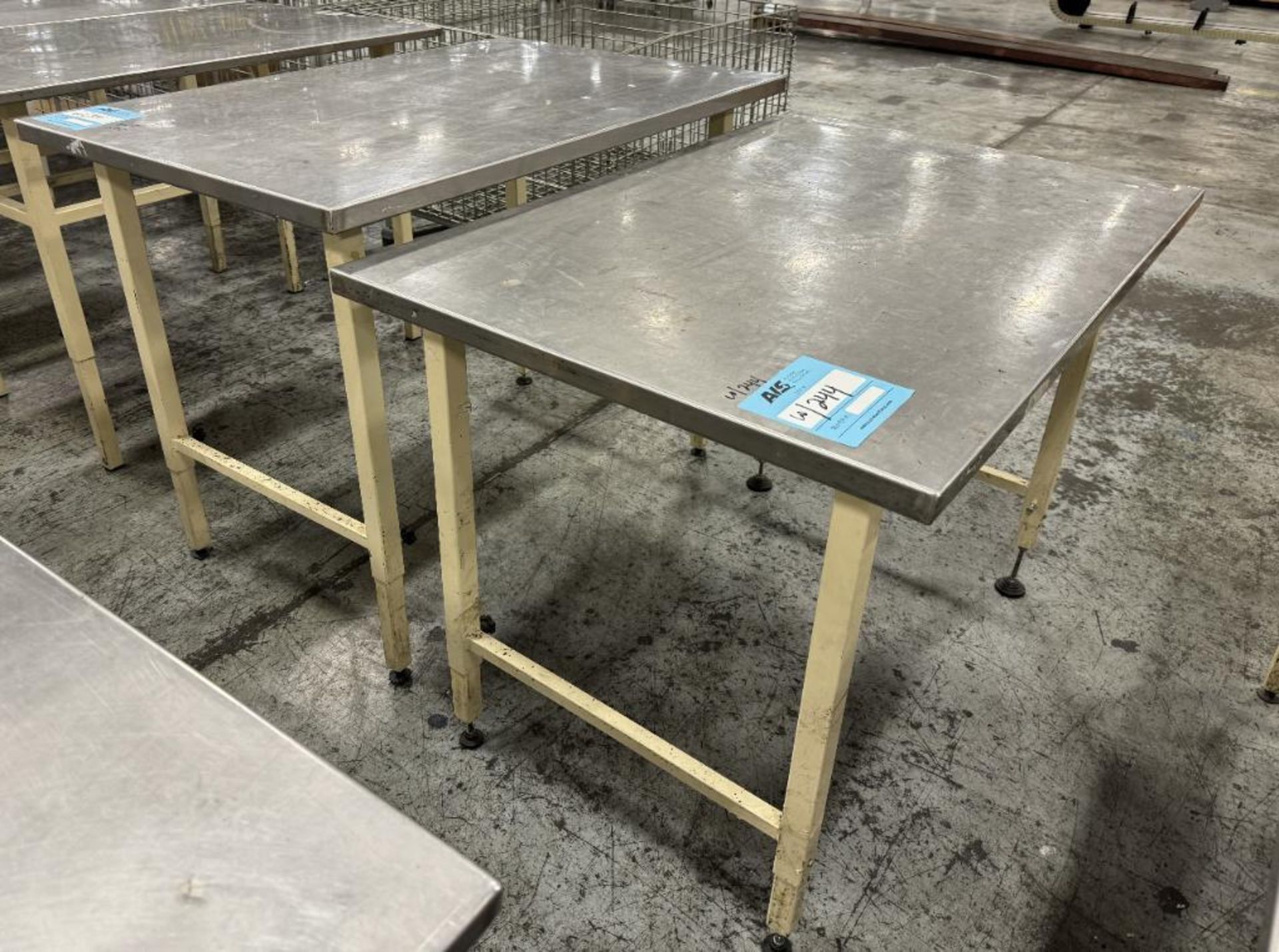Lot Of (4) Stainless Steel Top Tables. With steel frame.