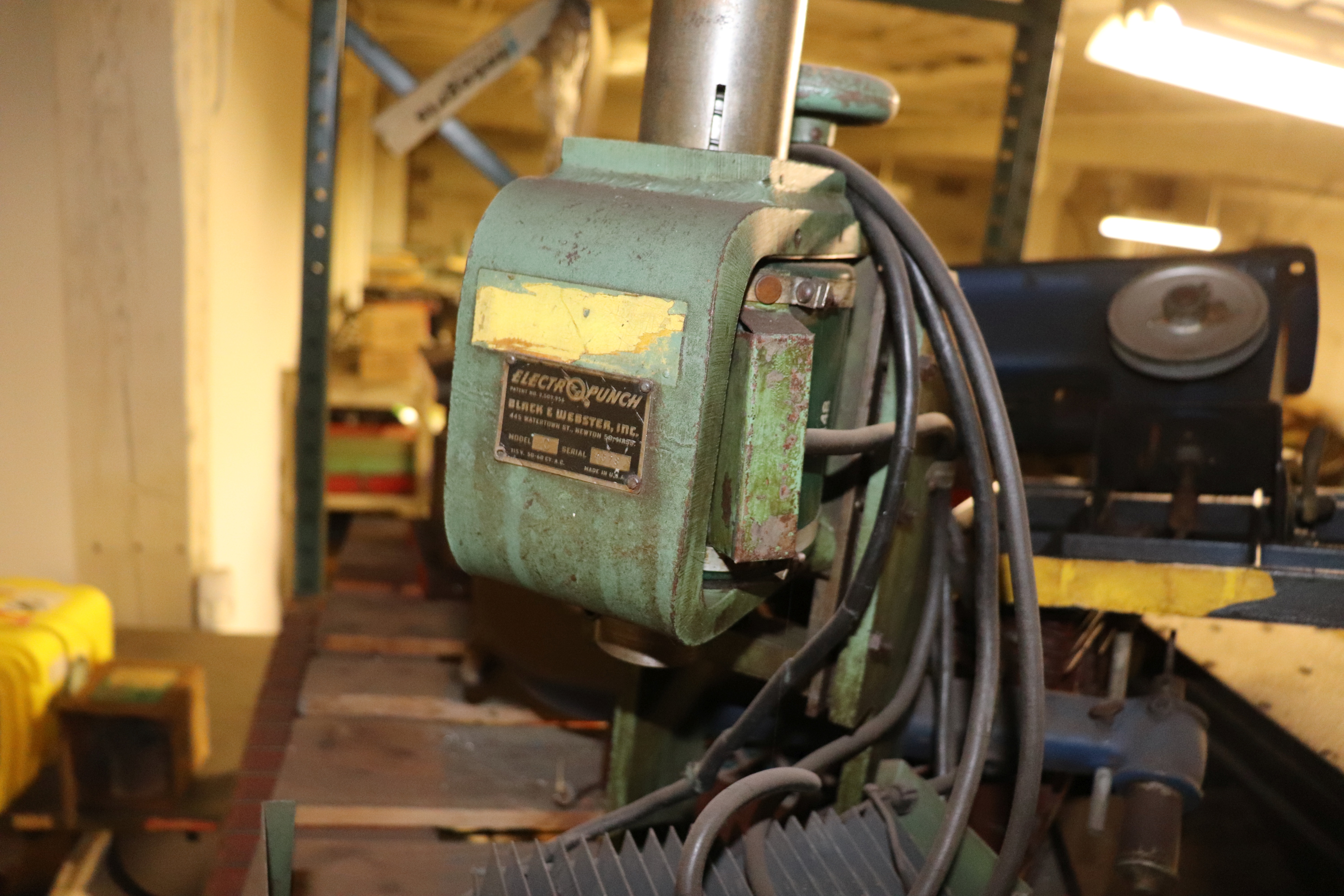One shelf of disassembled drill presses, electric punches, and other ...