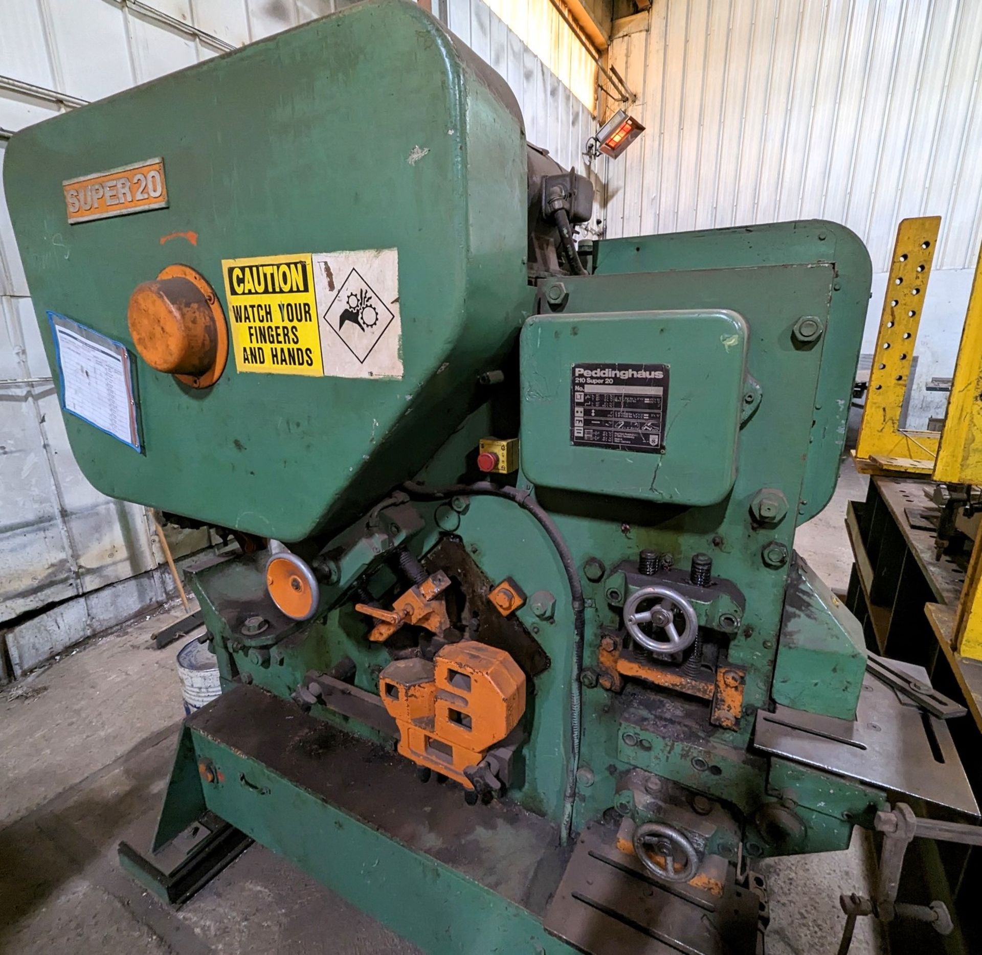 PEDDINGHAUS 210 SUPER 20 HYDRAULIC IRONWORKER, 120-TON PUNCH CAP., 6” X ...