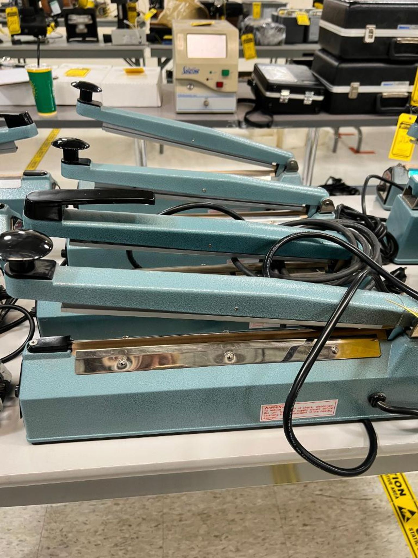 { Group of lots: 306, 307, 308 } (4x) Uline 12" Impulse Sealers, Model ...