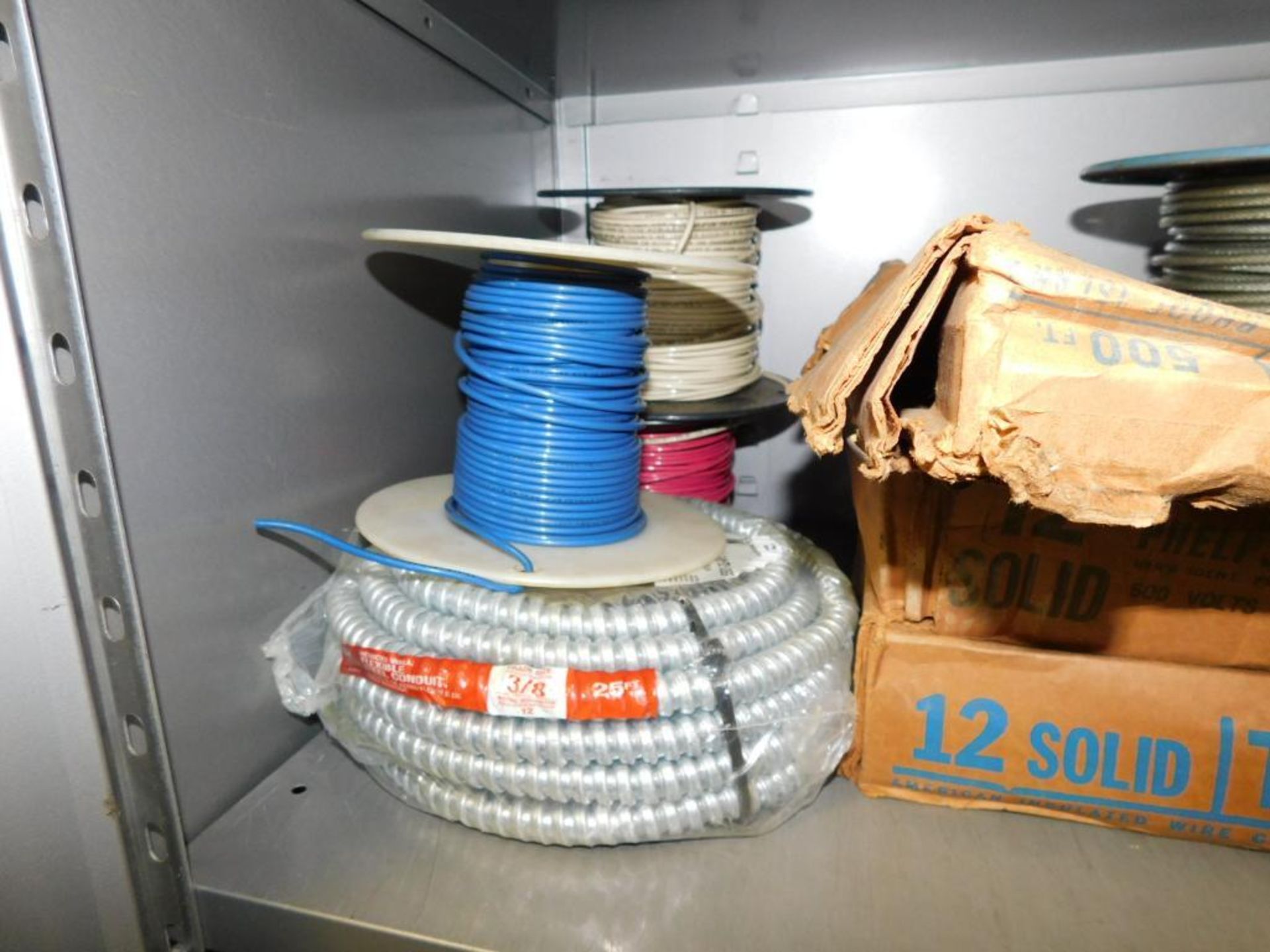LOT: Cabinet w/Contents, Flexible Conduit, Insulated Wire, (3) Rolls ...