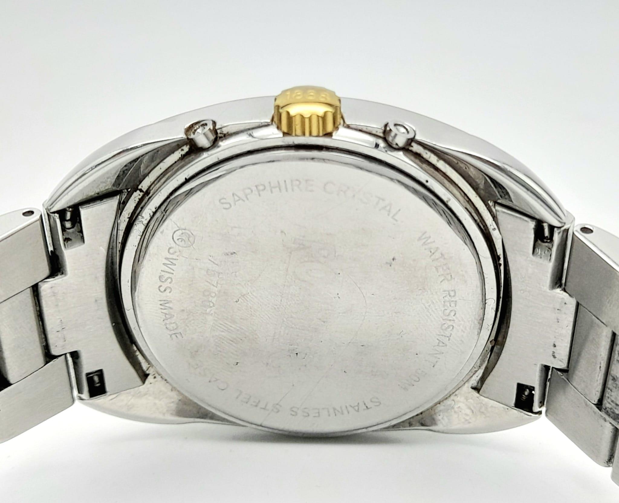 a "roamer" moon phase watch with 2 subdials on a stainless strap ...