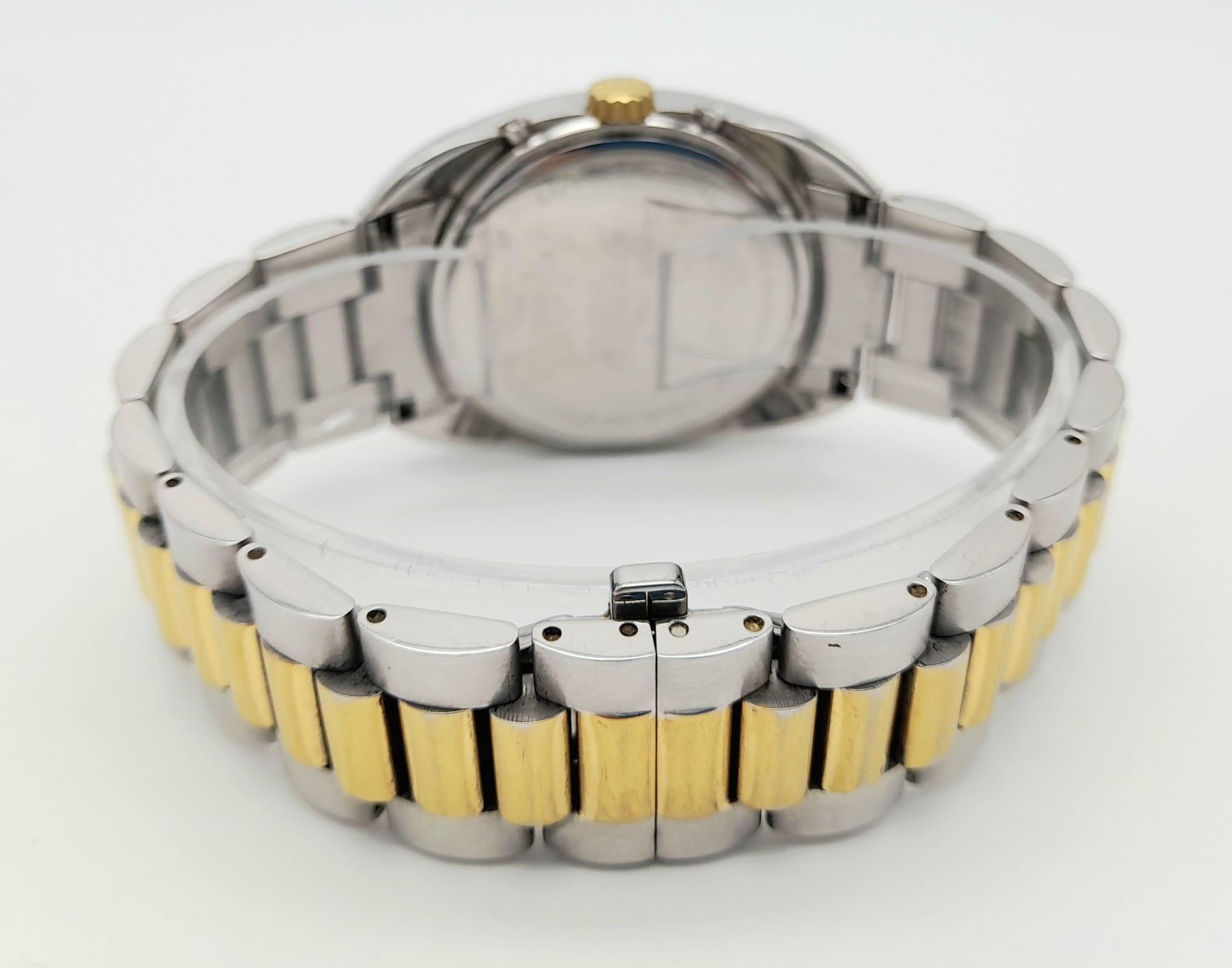 a "roamer" moon phase watch with 2 subdials on a stainless strap ...