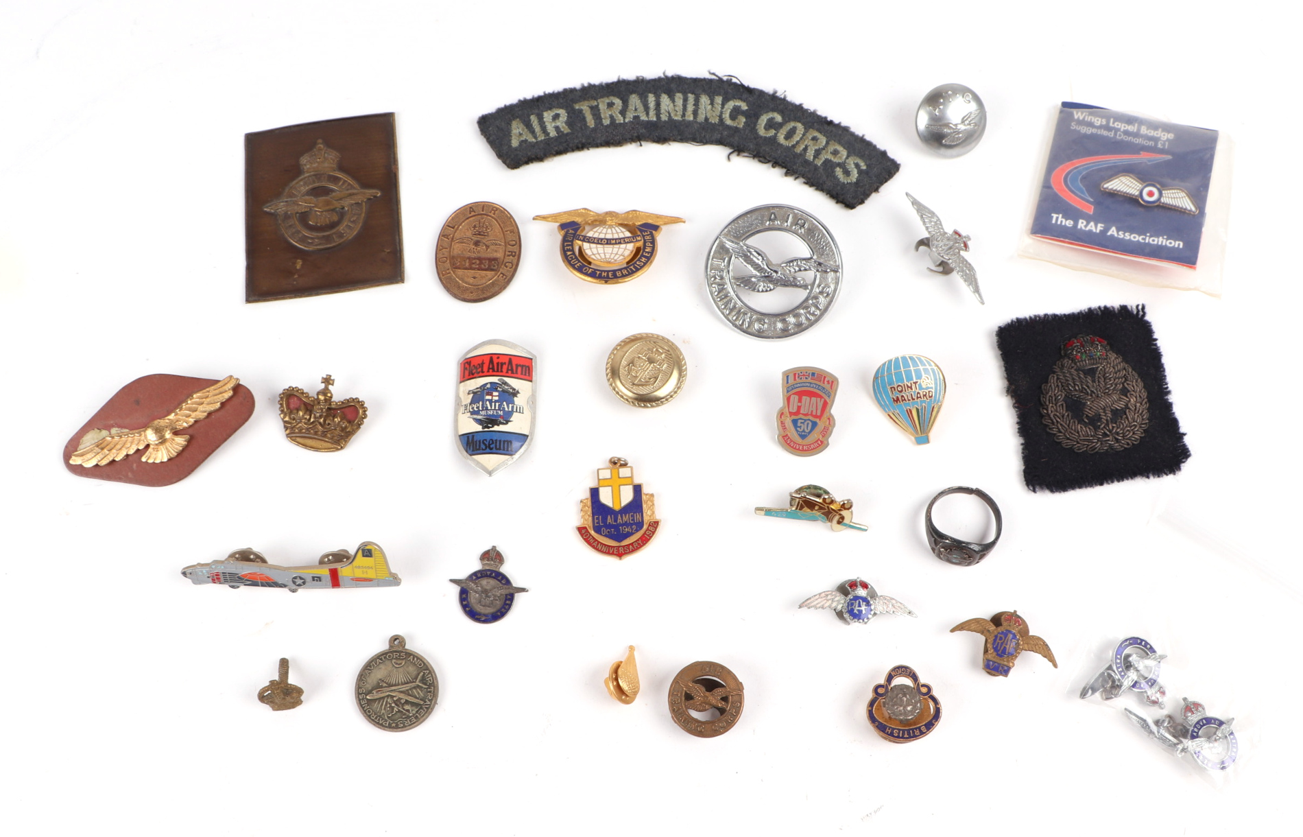 A framed display of 20 Royal Air Force enamel badges together with an ...