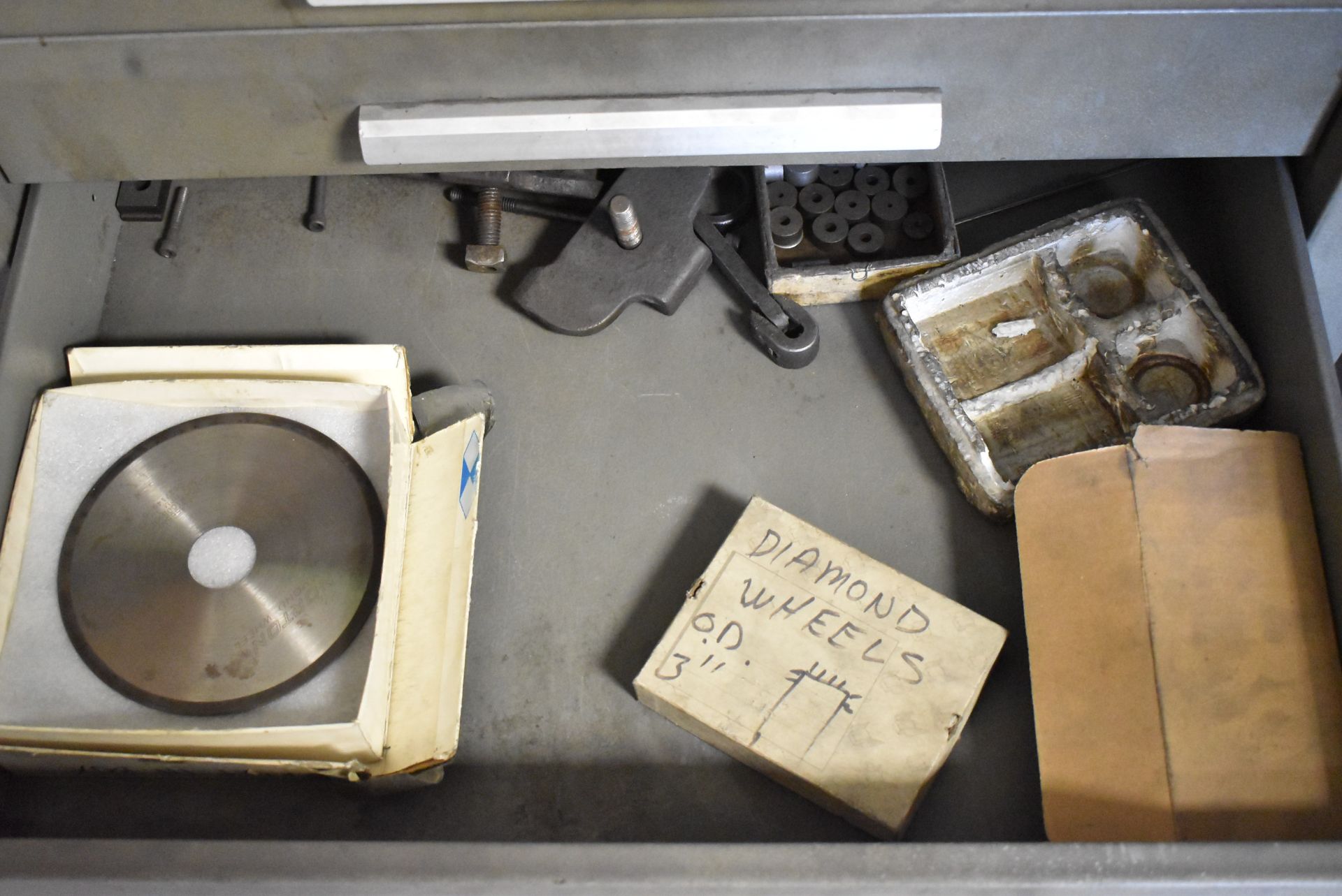 LOT/ TOOL CABINET WITH GRINDING WHEELS, HUBS, SPANNERS, DIAMOND NIB ...