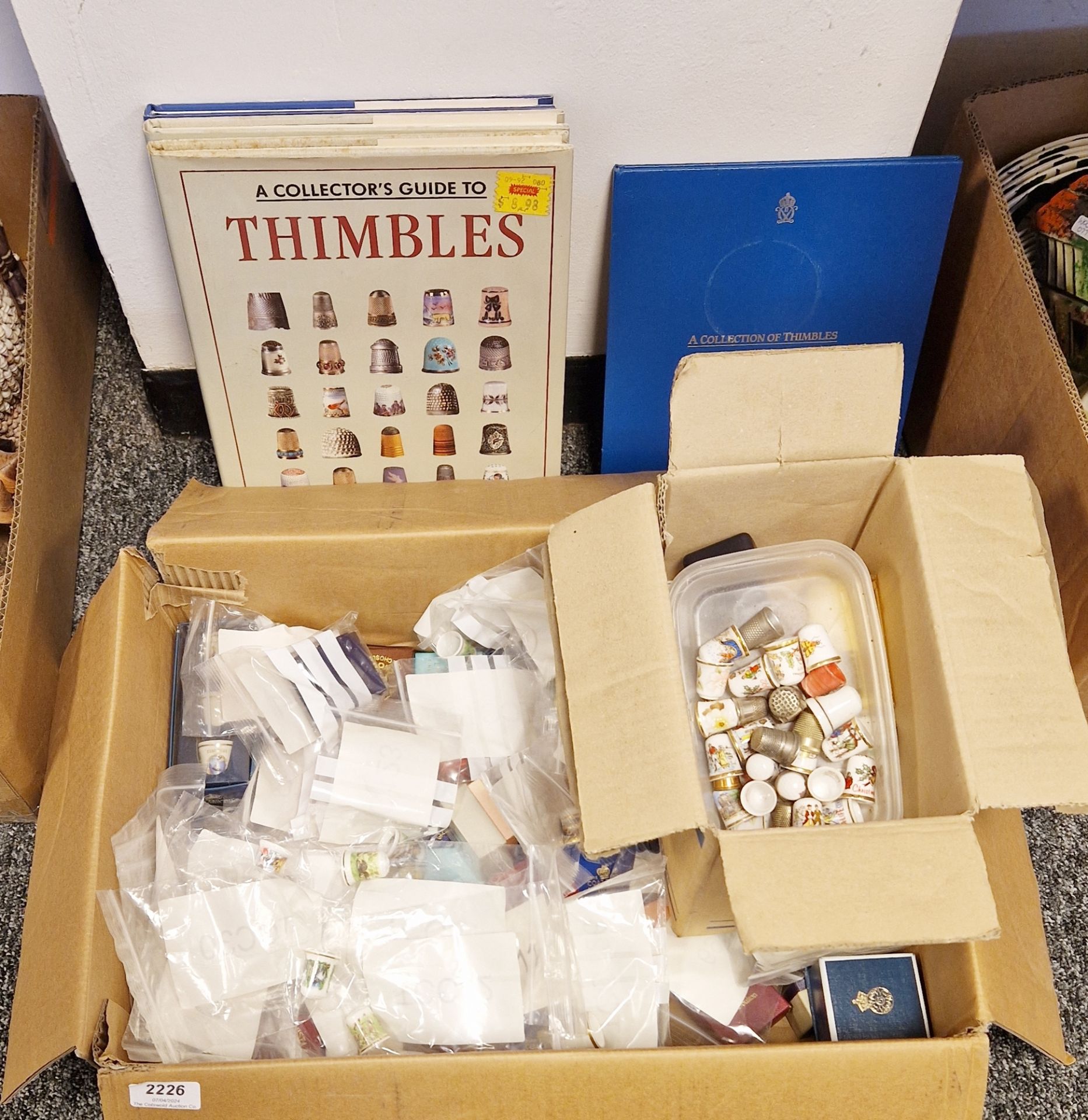 Collection of thimbles to include books on thimble collecting, boxed ...