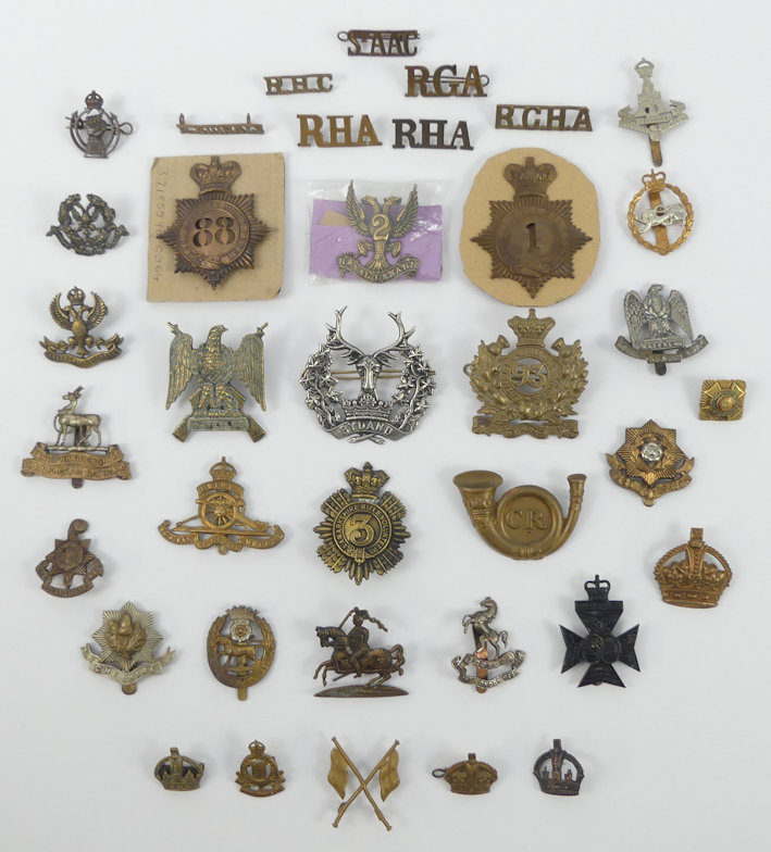 Thirty-five military cap badges, including Gordon Highlanders, Dragoon ...