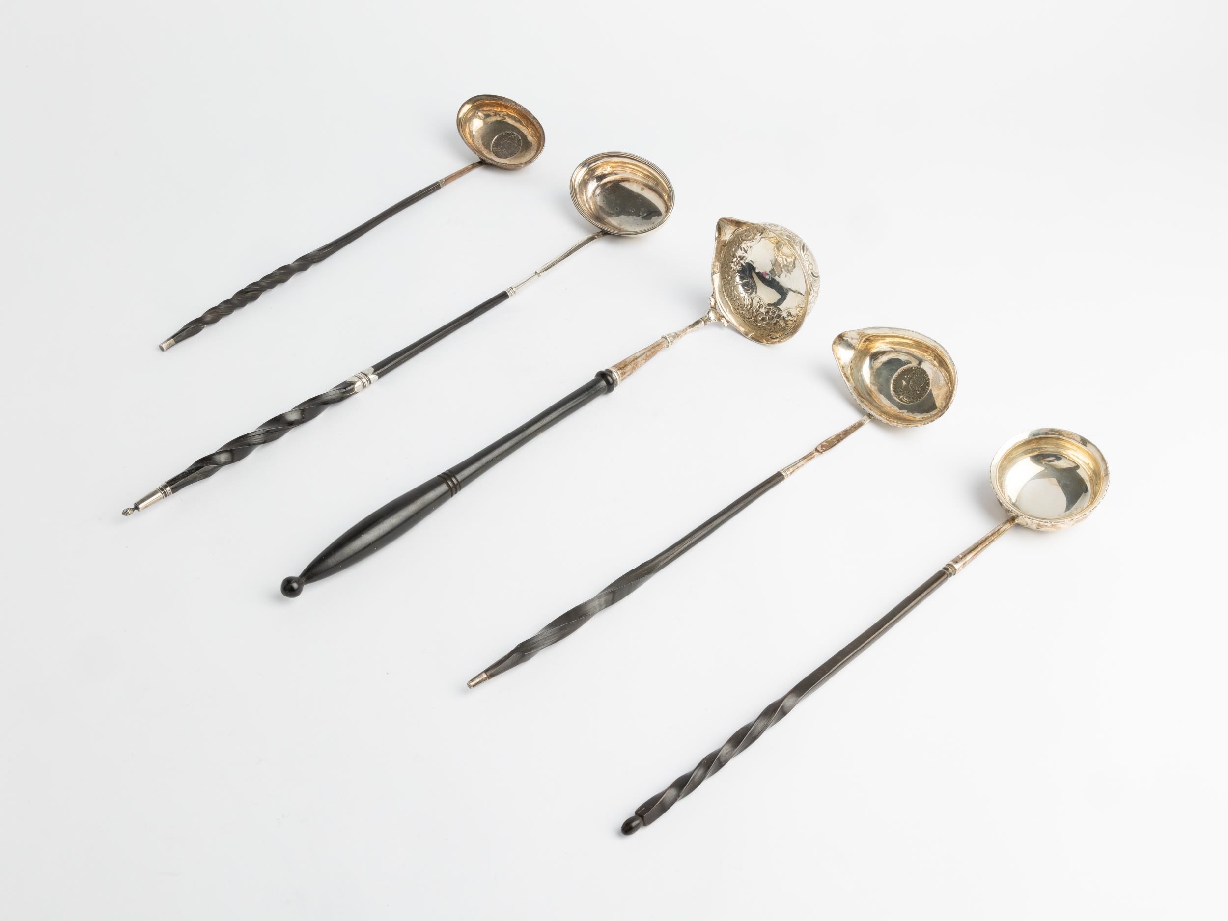 FIVE BALEEN HANDLE GEORGIAN PUNCH LADLES, LONDON C.1800. 33 cm to 42 cm.