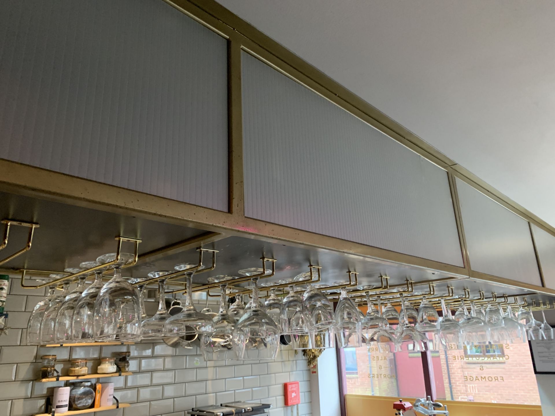 Assorted Drinking Glassware together with Suspended Overhead Cabinet ...